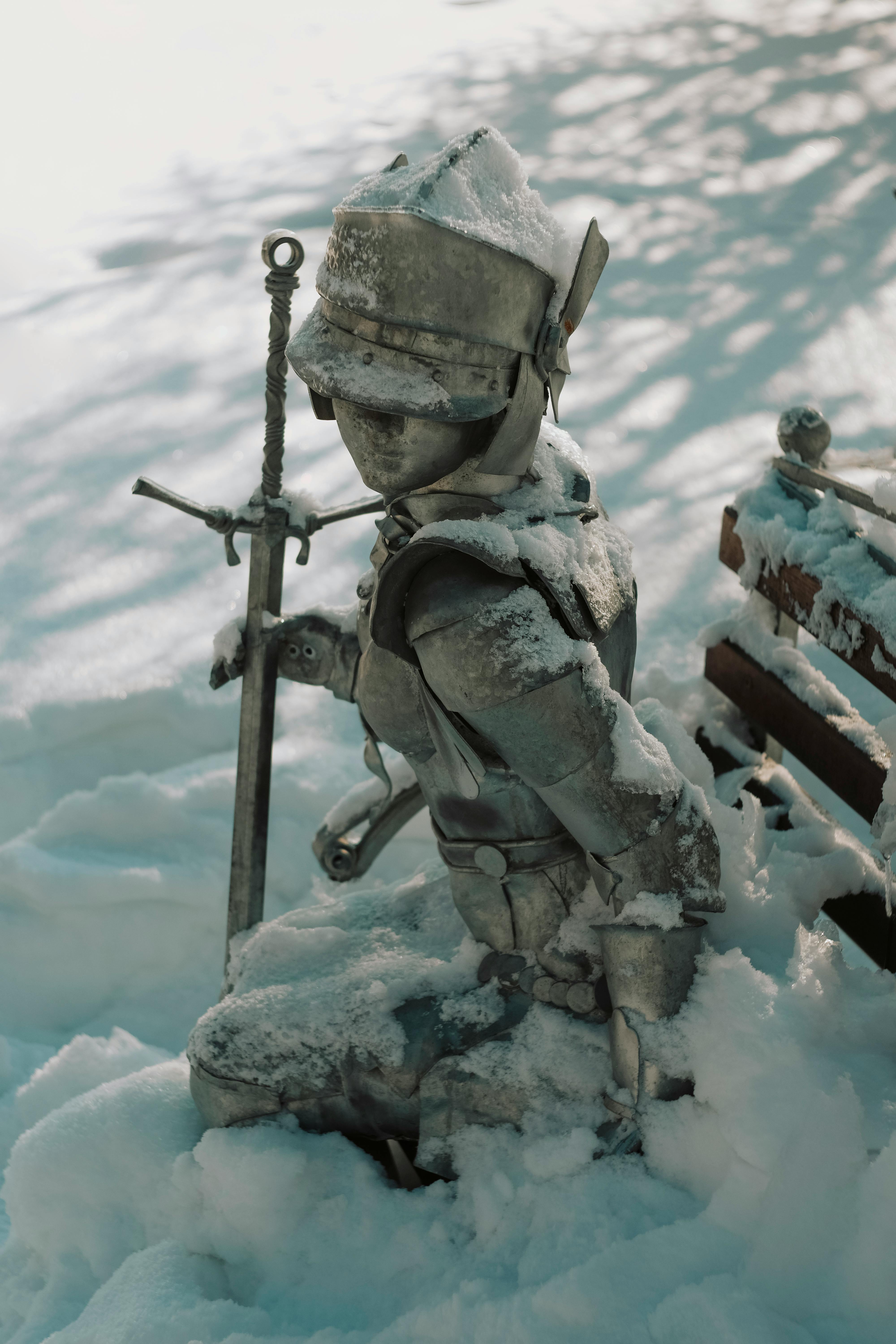 Snow-Covered Knight Statue in Winter Setting · Free Stock Photo