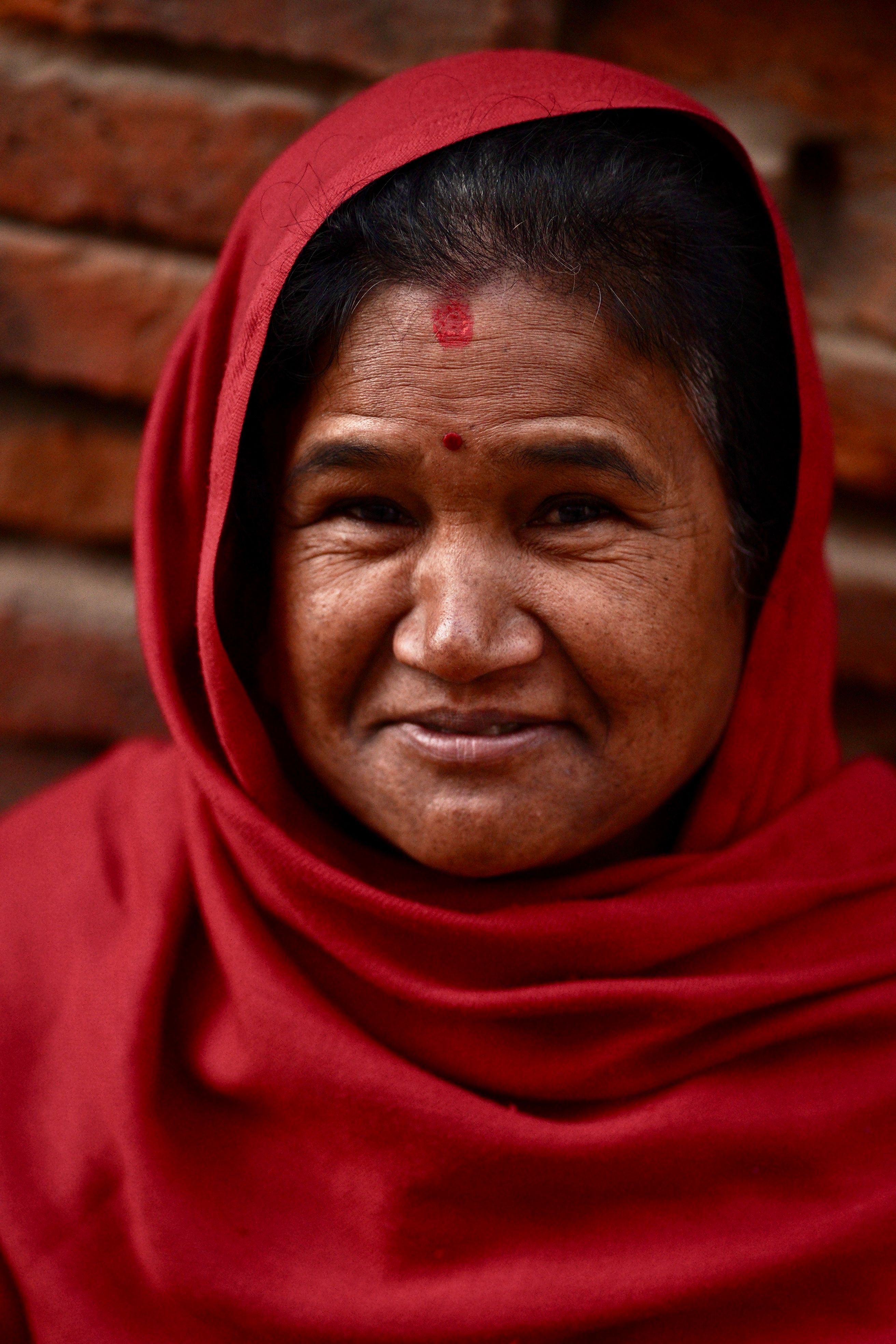 Portrait of a Smiling Nepali Woman in Traditional Attire · Free Stock Photo