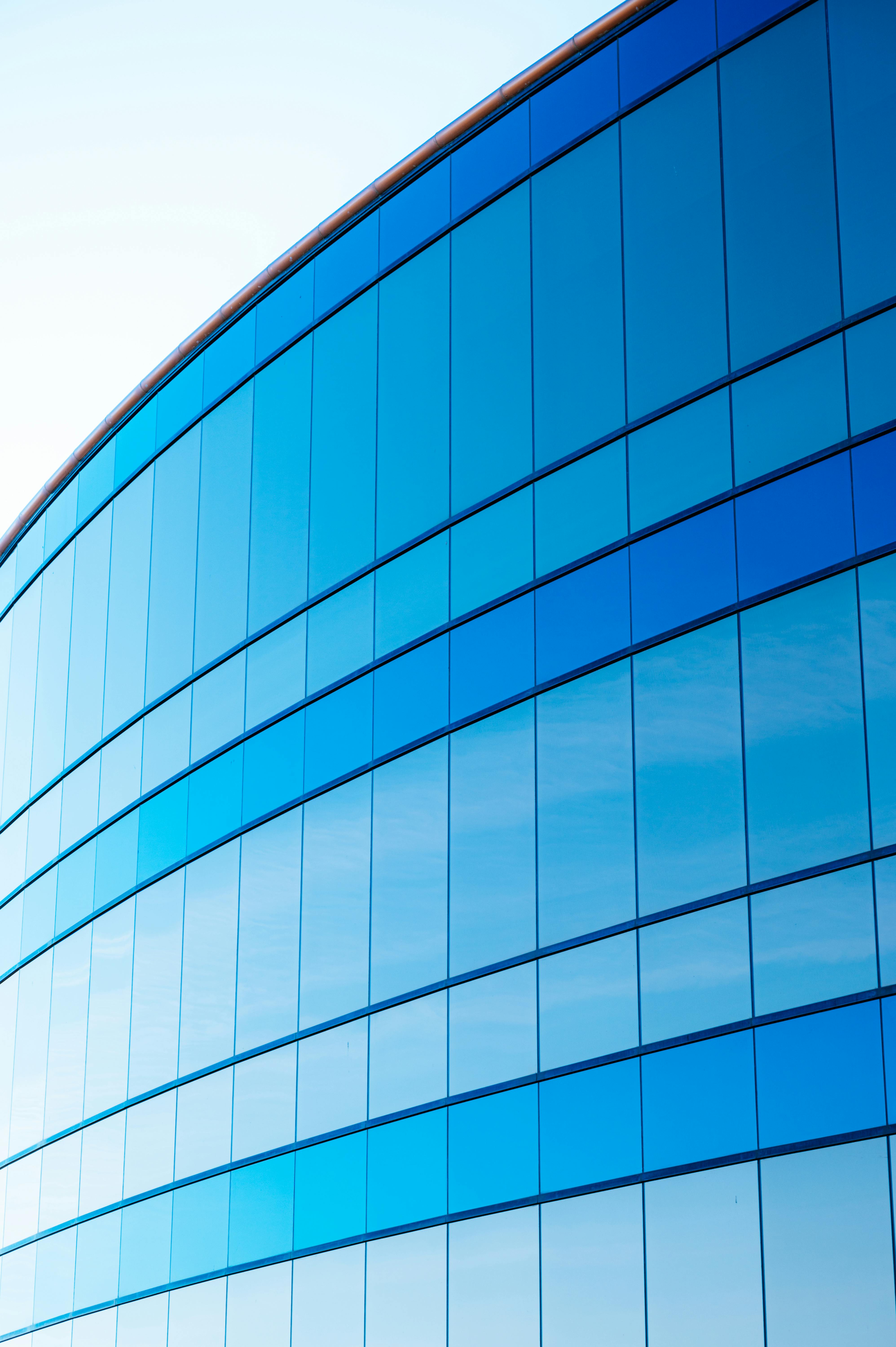 Blue and White Glass Walled Building · Free Stock Photo