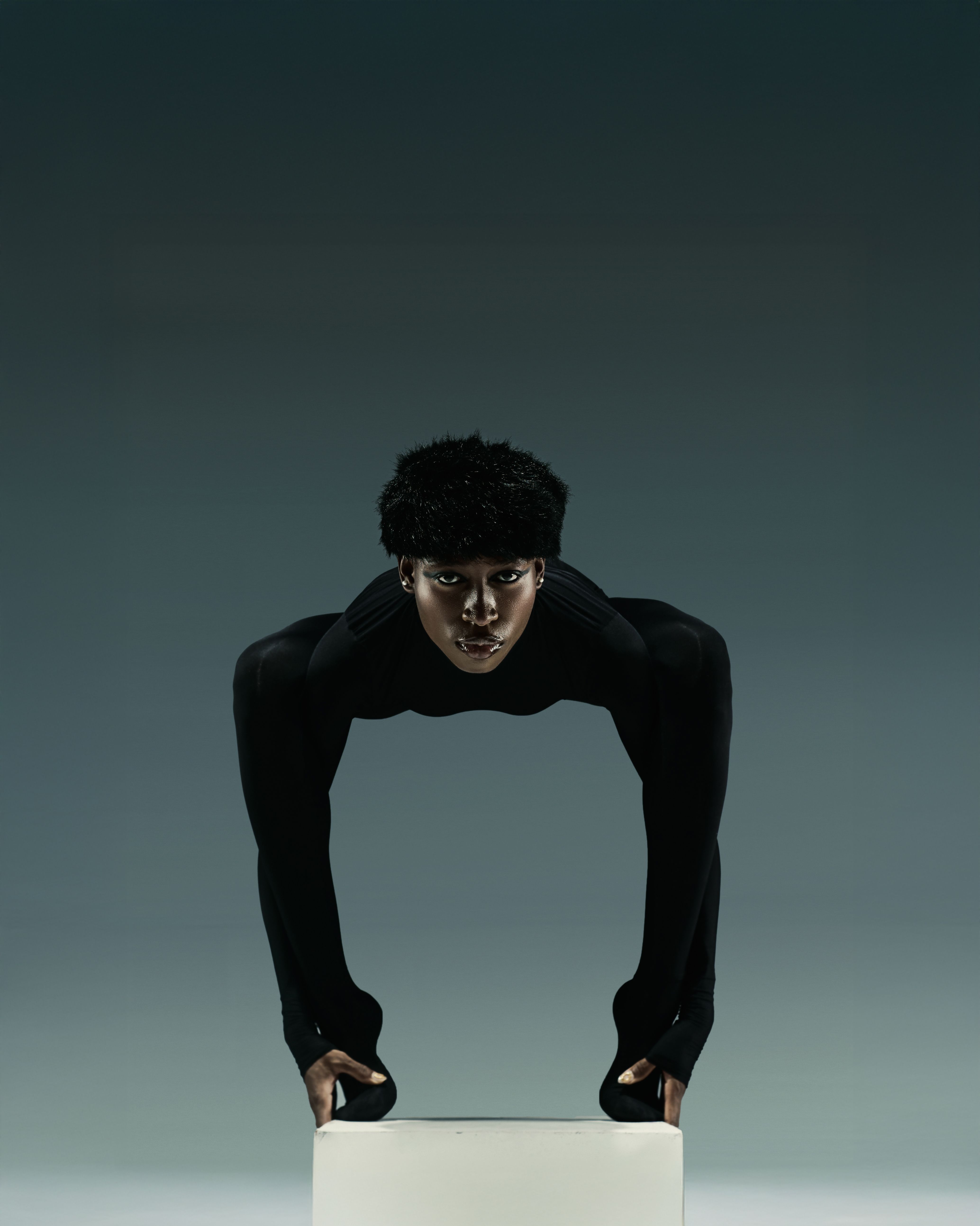 Dynamic Pose of Athlete in Studio Setting · Free Stock Photo