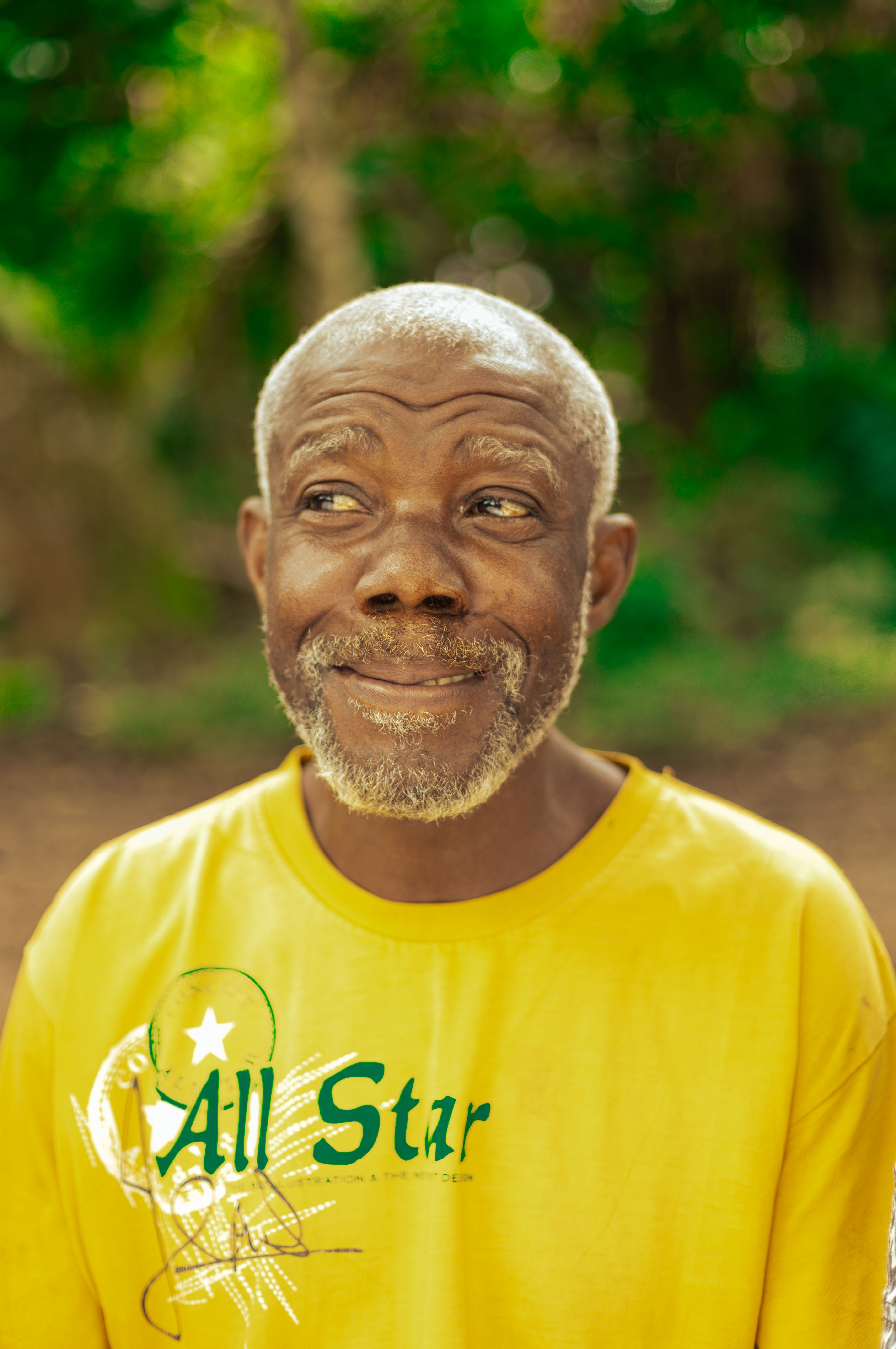 Portrait of Elderly Man in Vibrant Red Shirt · Free Stock Photo