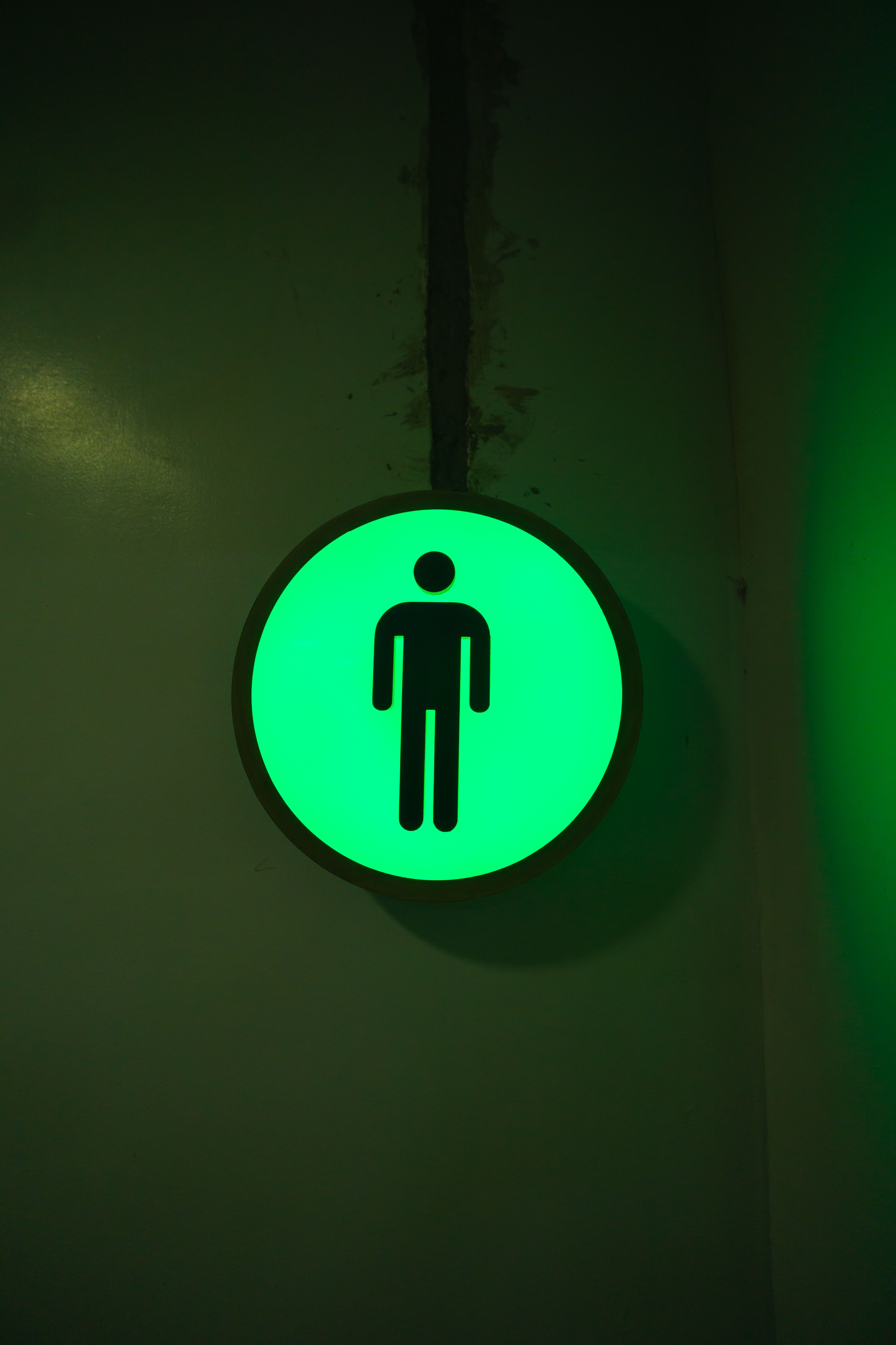 Green Illuminated Male Restroom Sign · Free Stock Photo