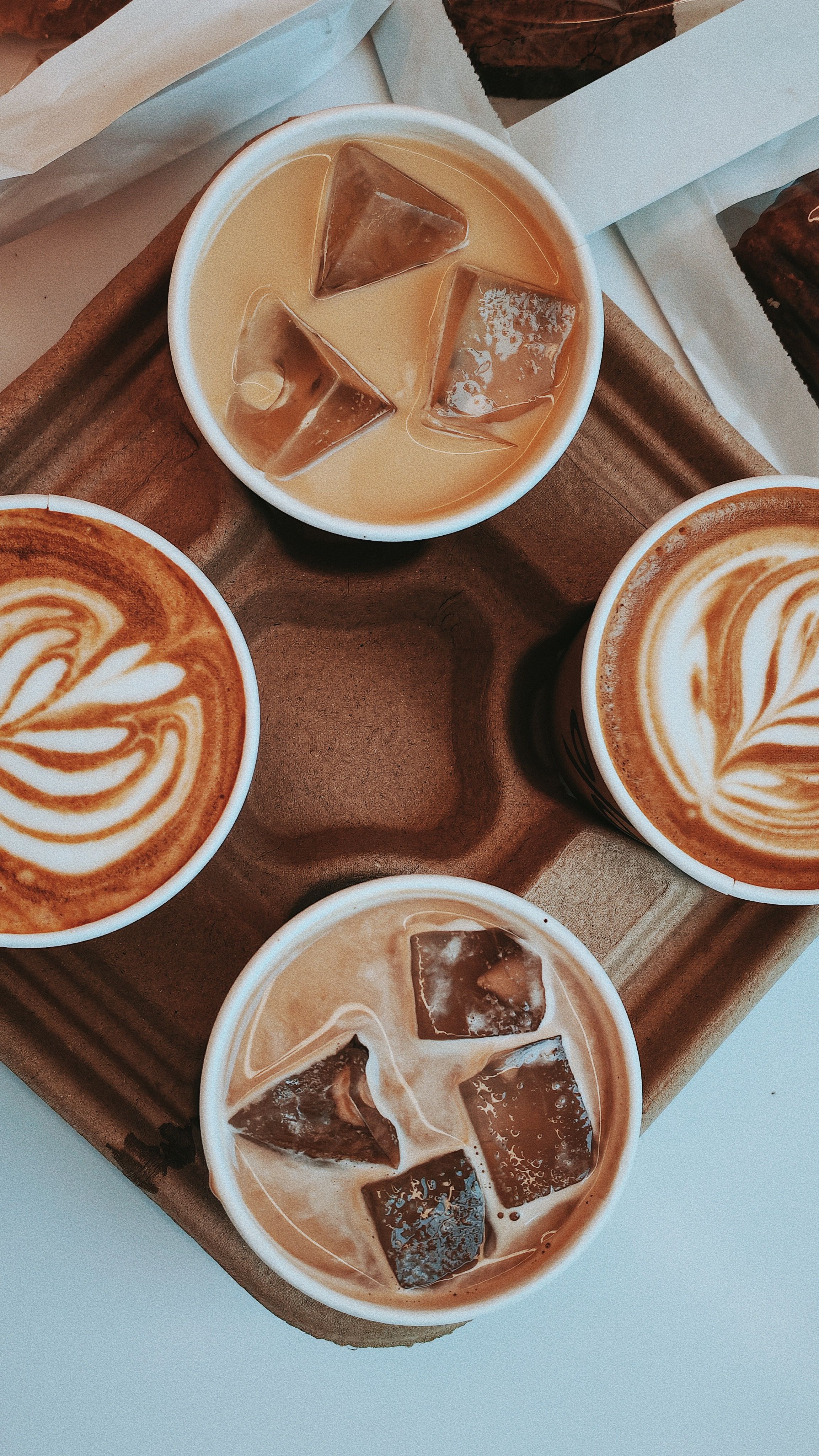Assorted Coffees in To-Go Tray with Latte Art · Free Stock Photo