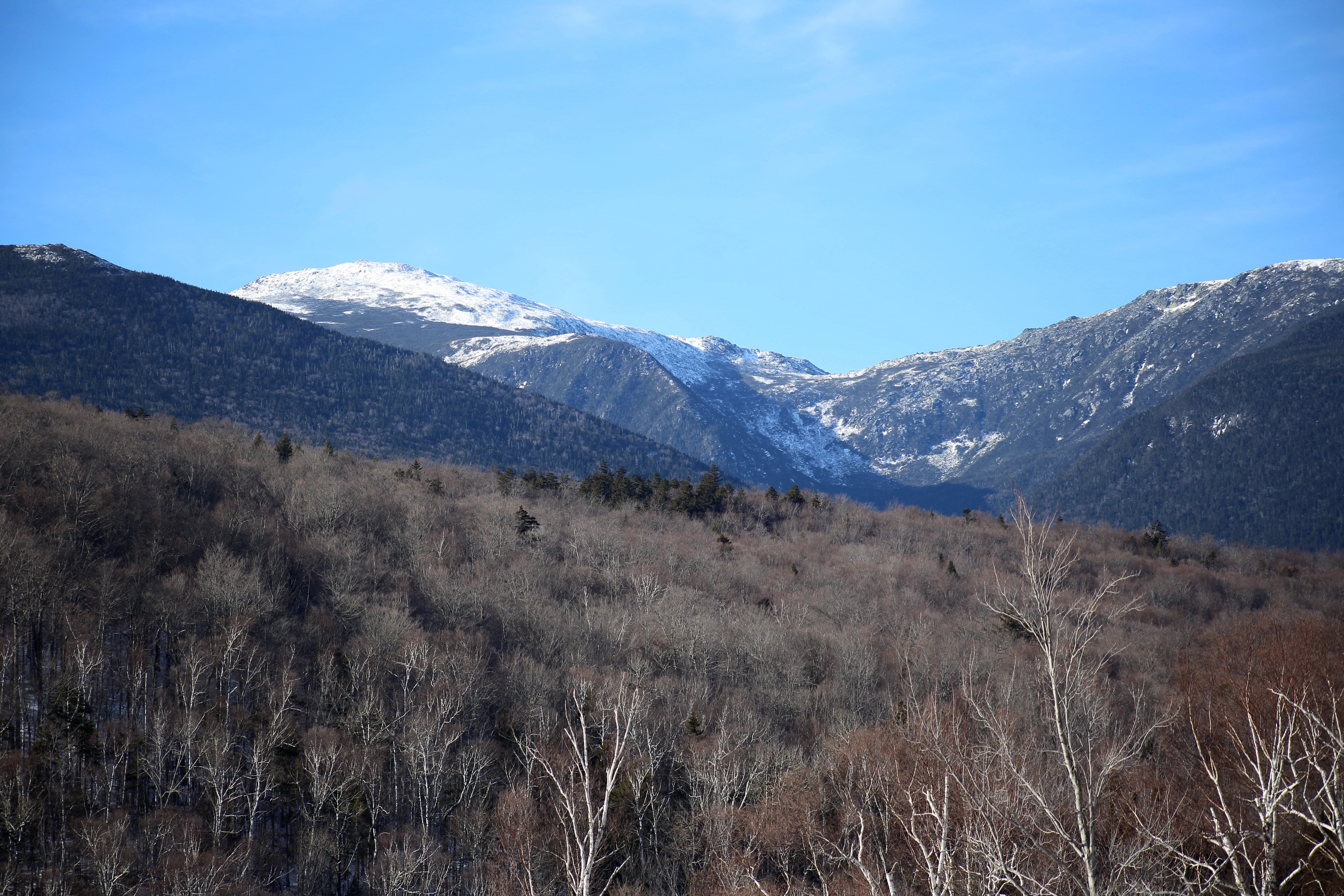 Snow Covered Mountain Under Sunny Cloudy Day · Free Stock Photo