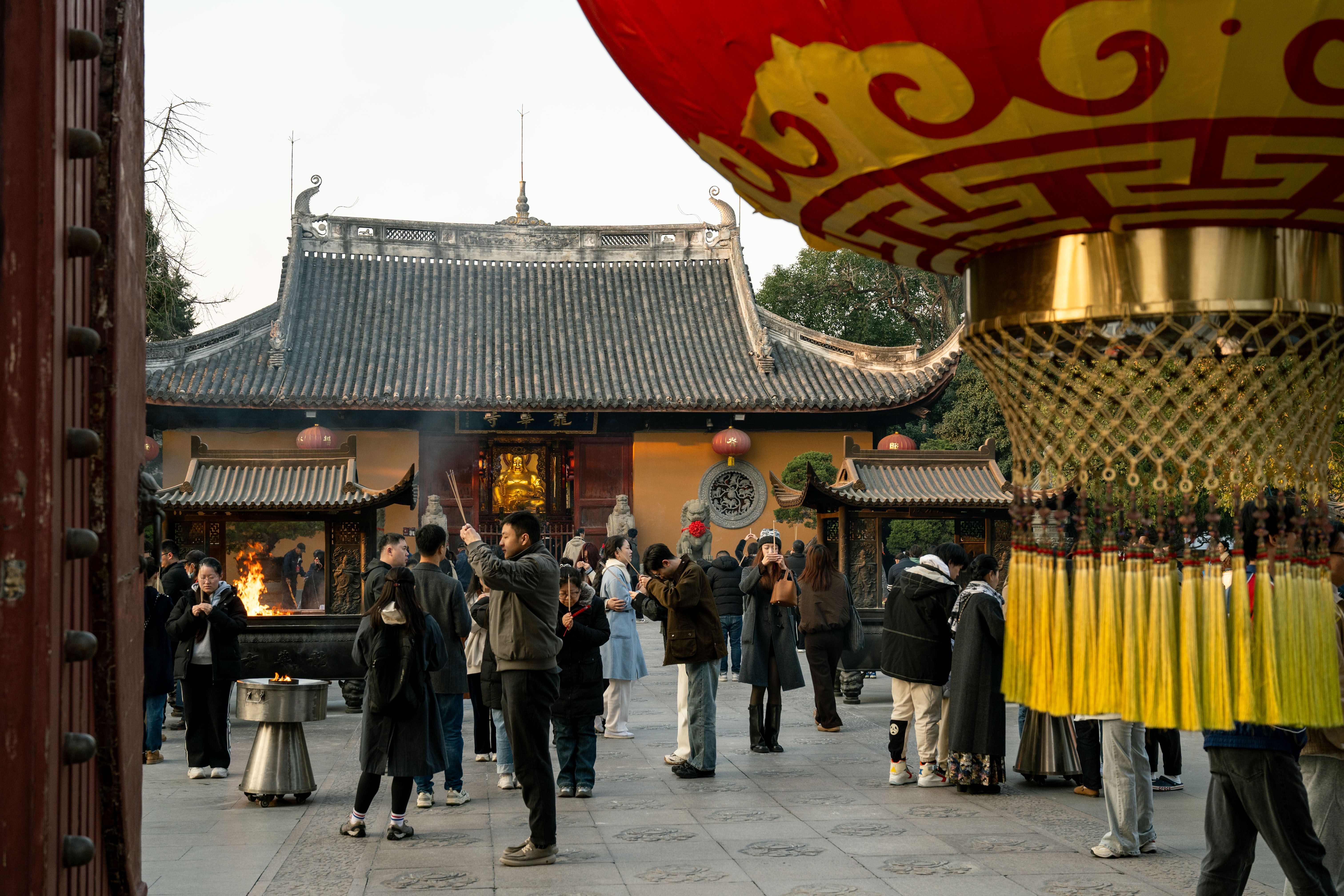 People Gather at Chinese Temple Courtyard · Free Stock Photo