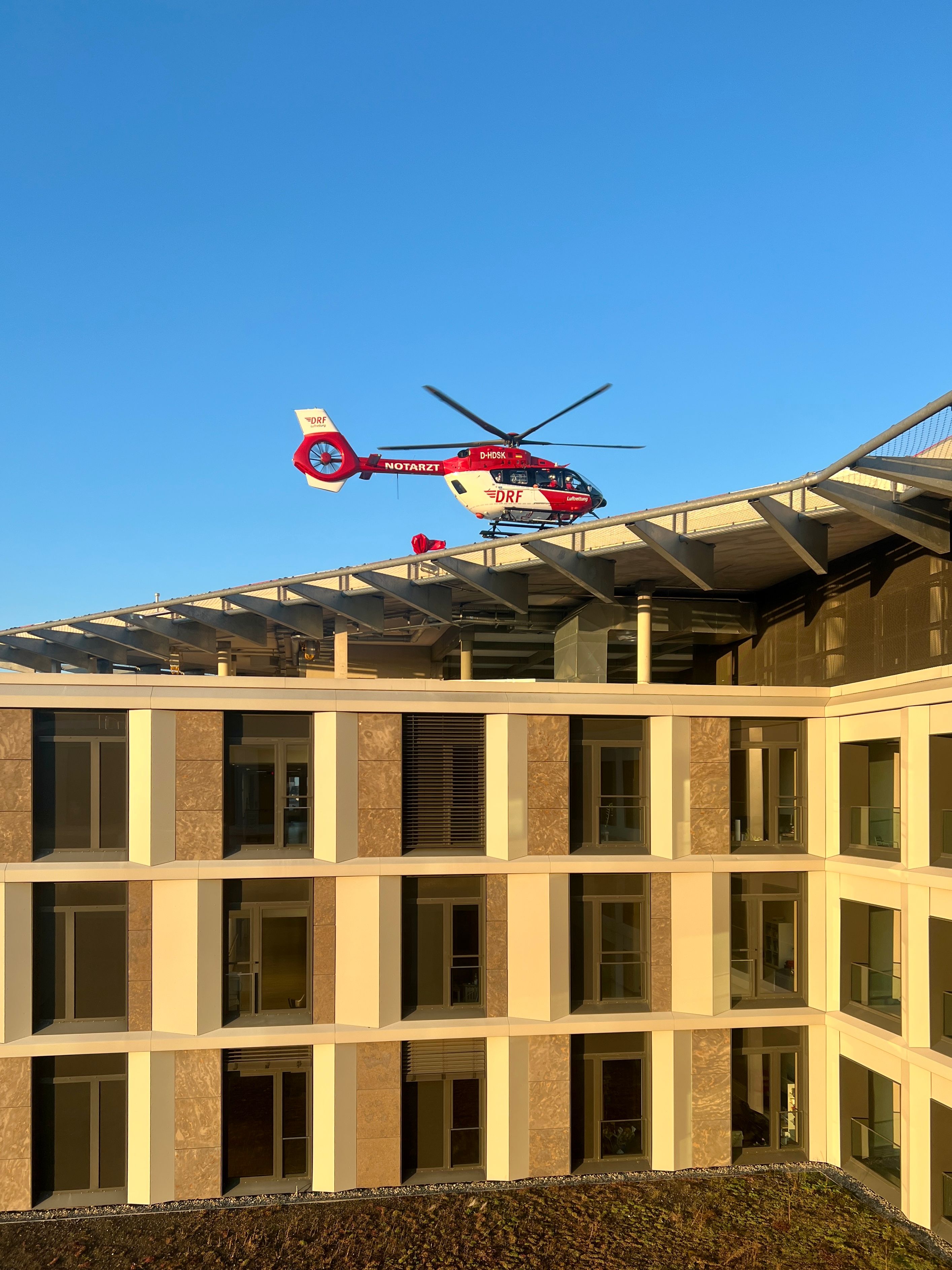Medical Helicopter on Hospital Rooftop Under Clear Sky · Free Stock Photo