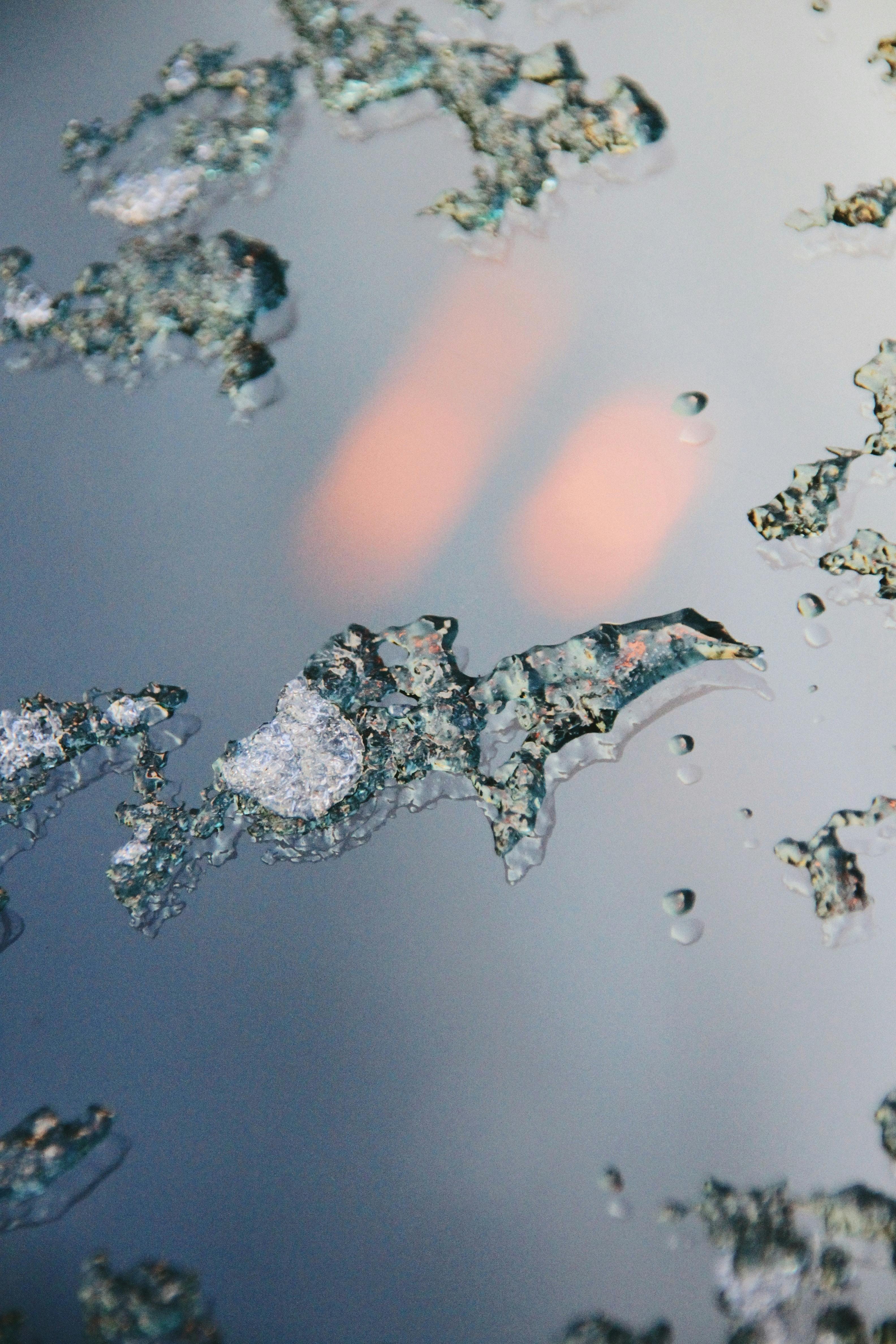 Water Droplets on Gray Surface · Free Stock Photo