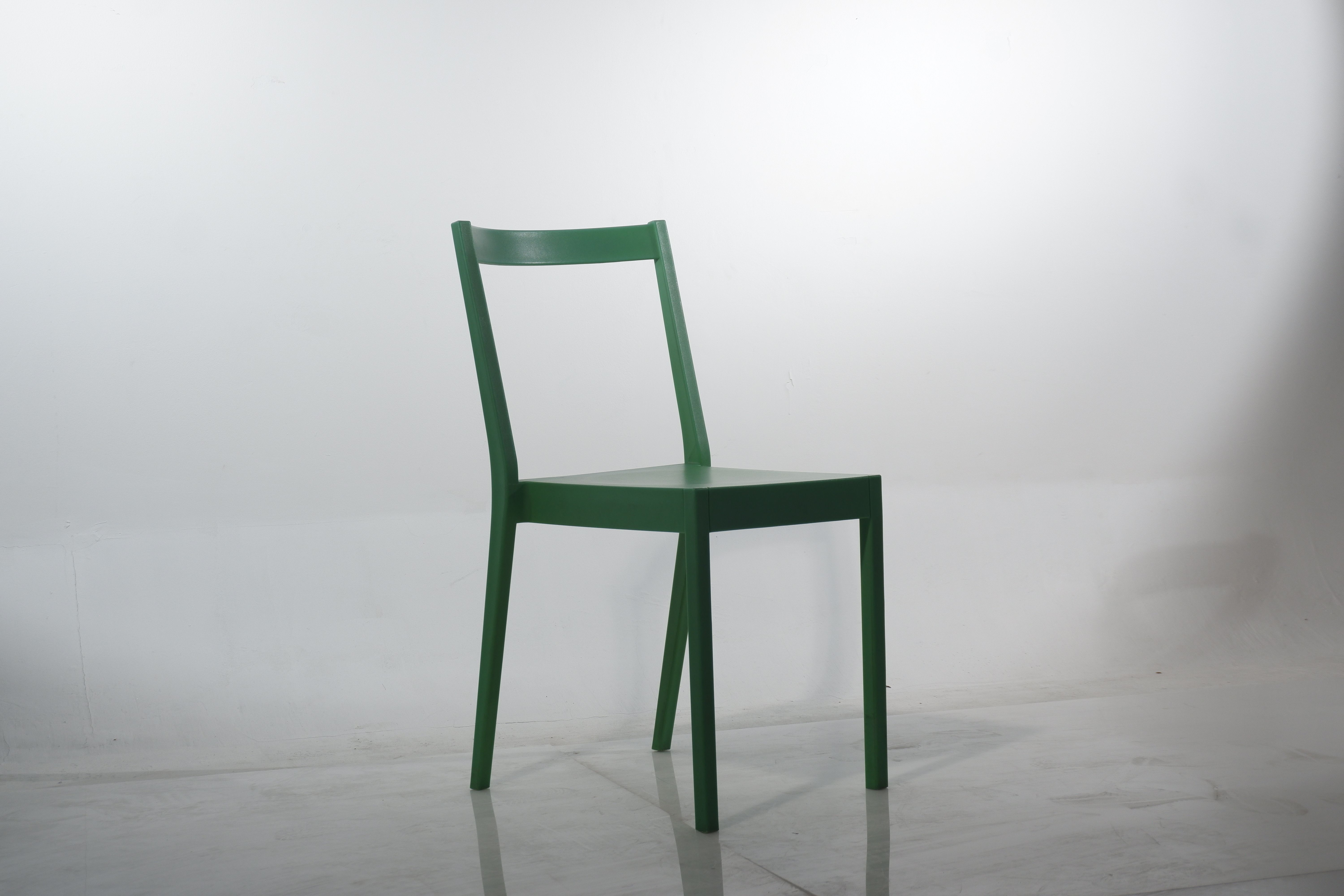 Elegant Minimalist Green Chair in Studio · Free Stock Photo