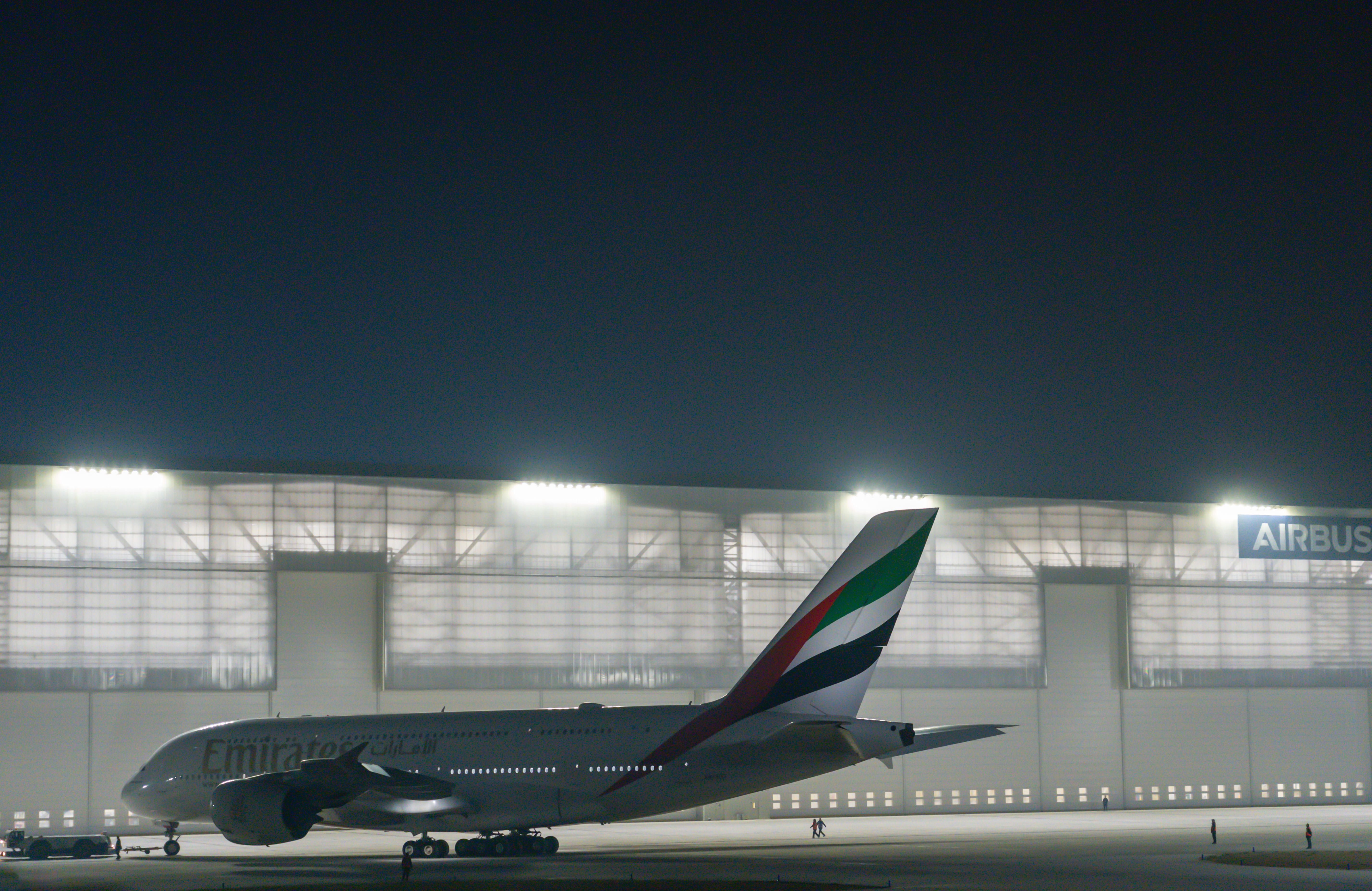 Emirates Airbus A380 at Night Airport Hangar · Free Stock Photo