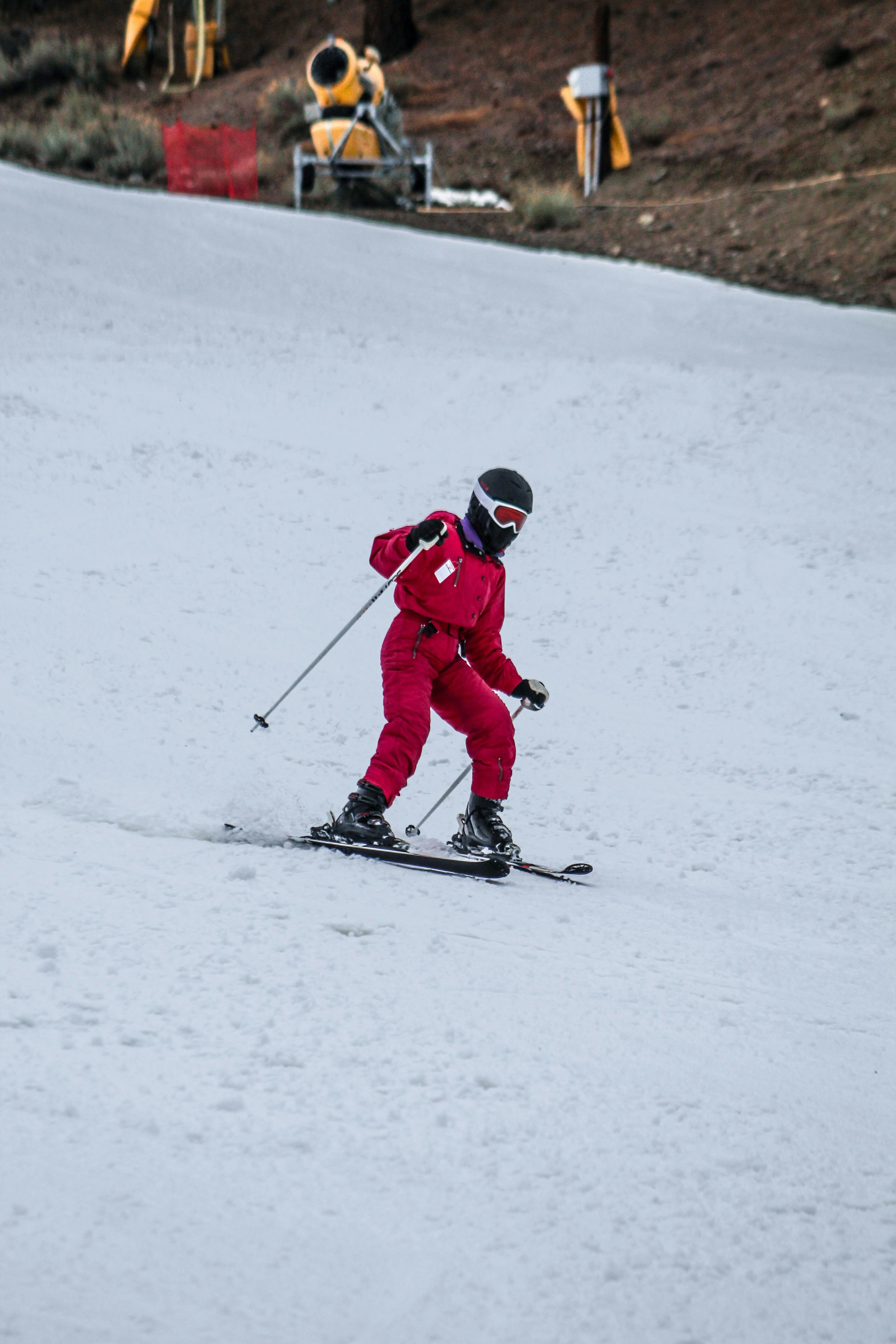 Person in Red Jacket and Red Pants Riding on Snow Ski · Free Stock Photo
