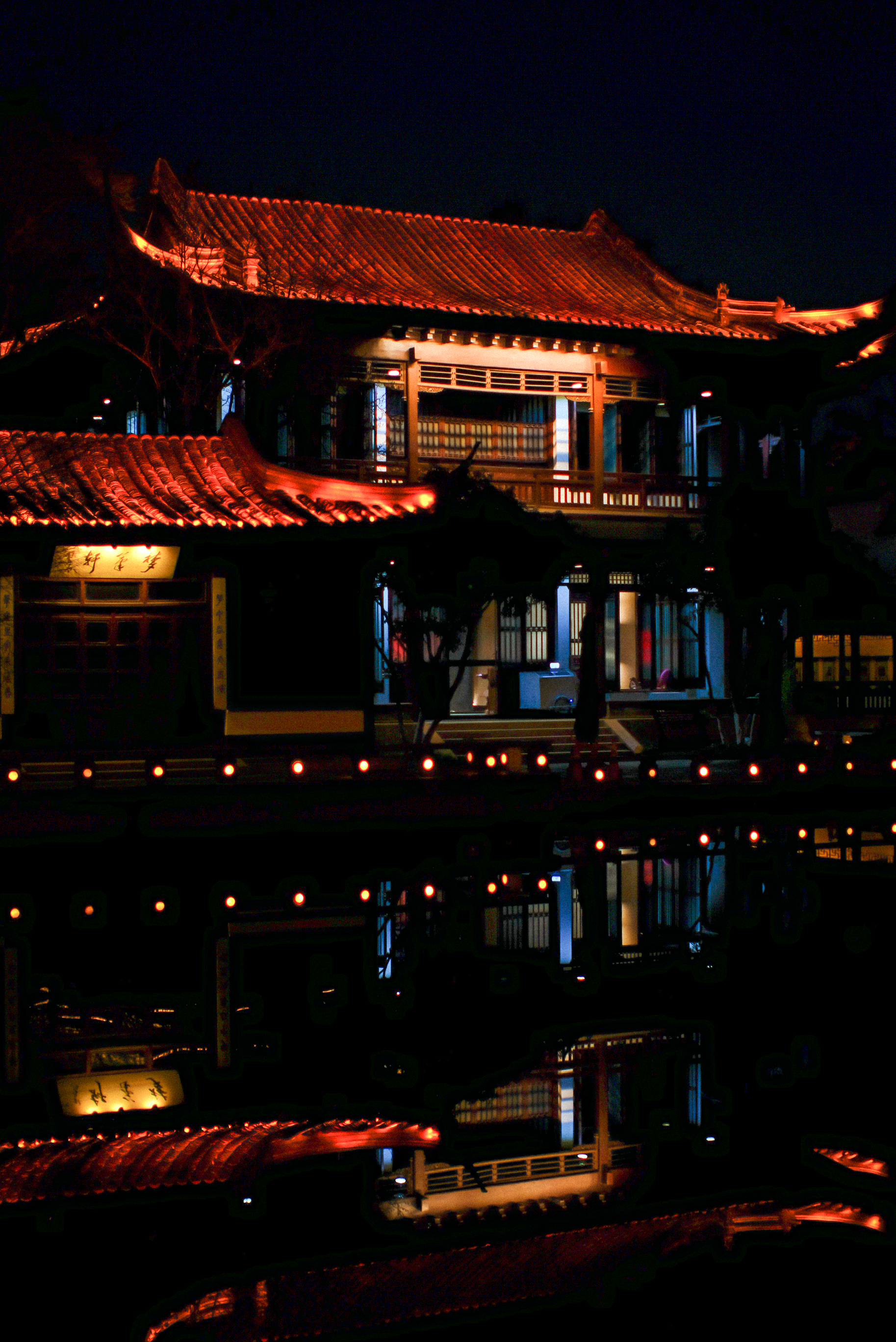 Illuminated Traditional Asian Building at Night · Free Stock Photo