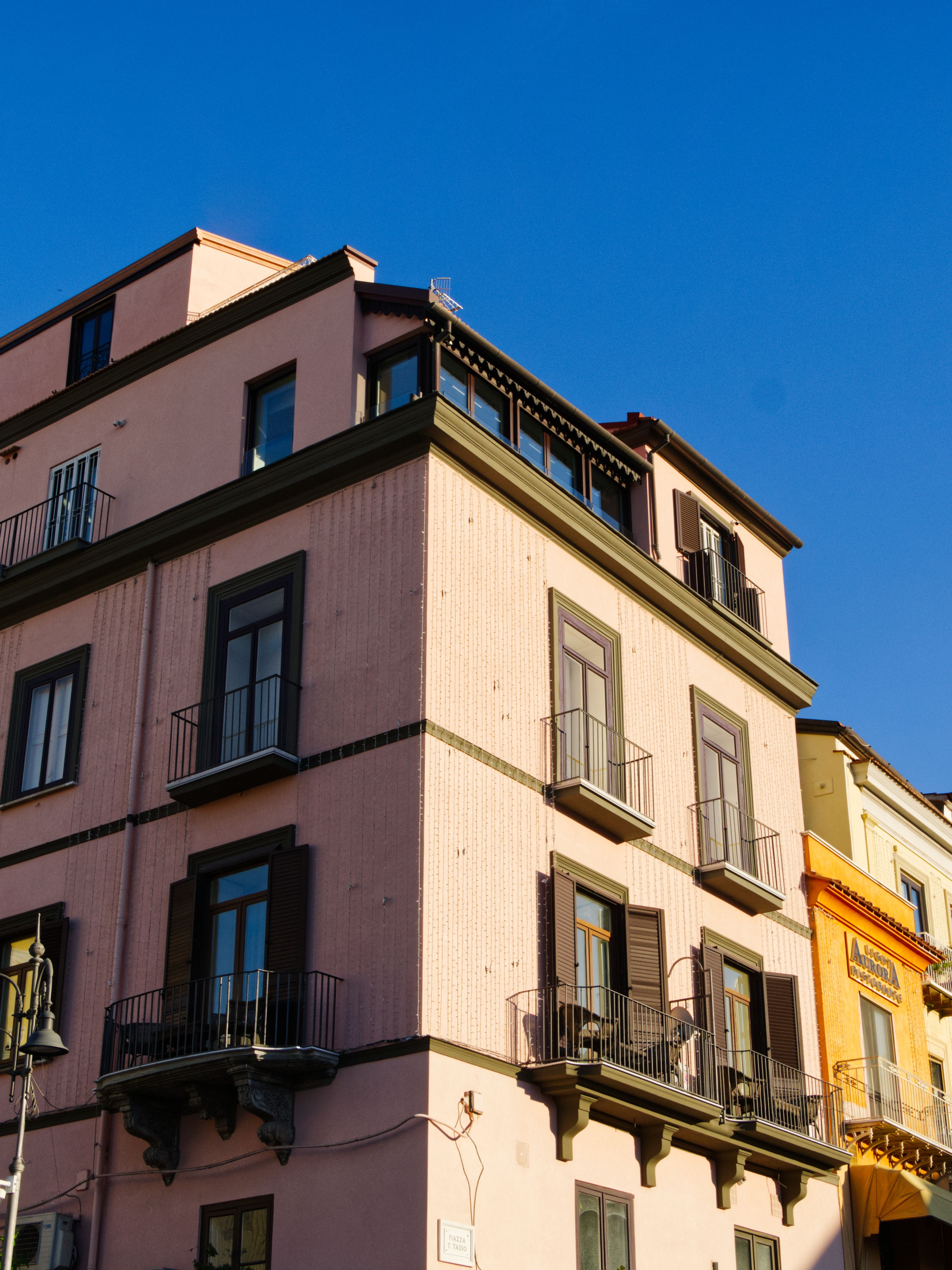 Colorful European building under clear blue sky · Free Stock Photo
