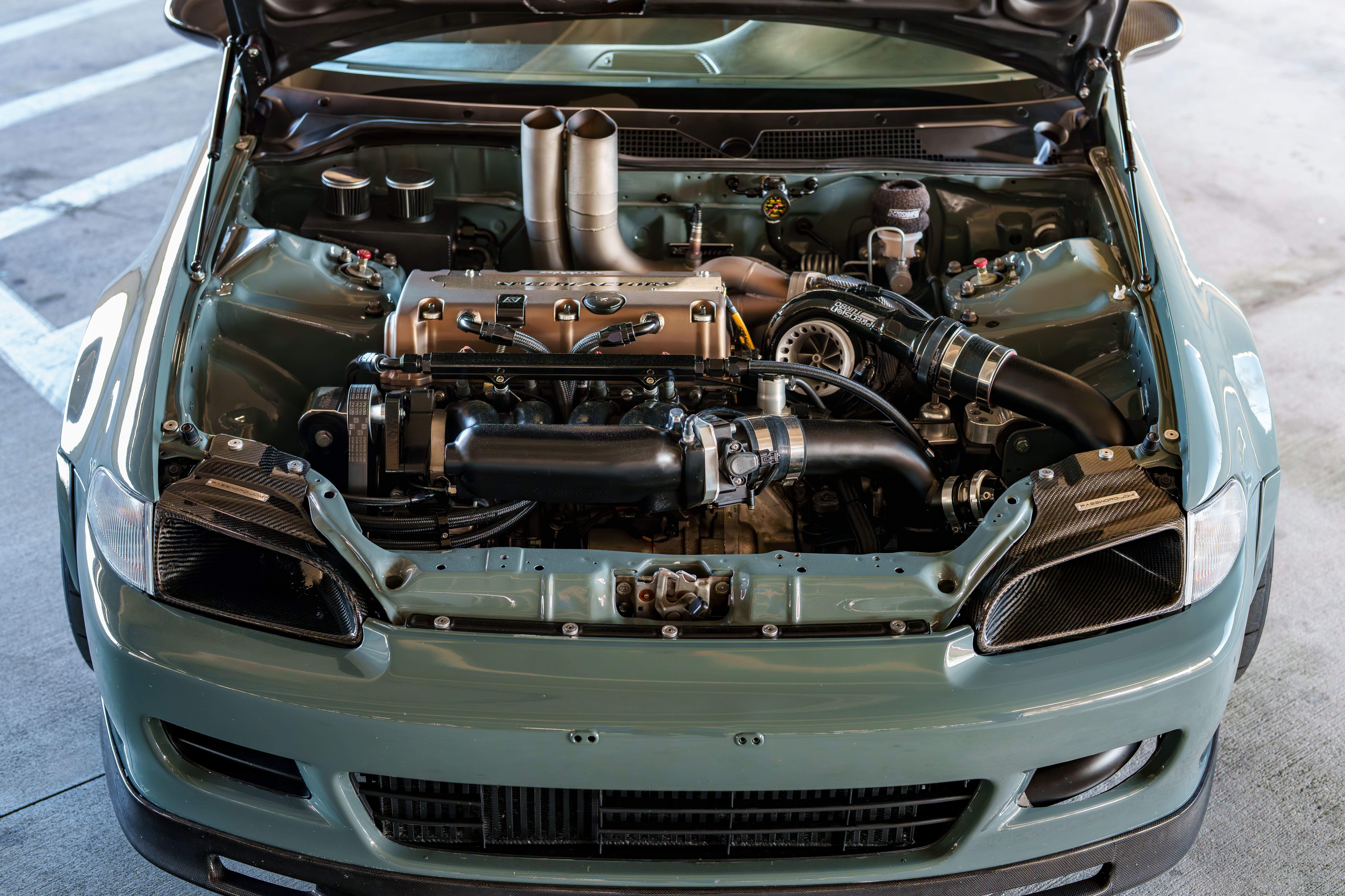High-Performance Car Engine in Garage Setup · Free Stock Photo