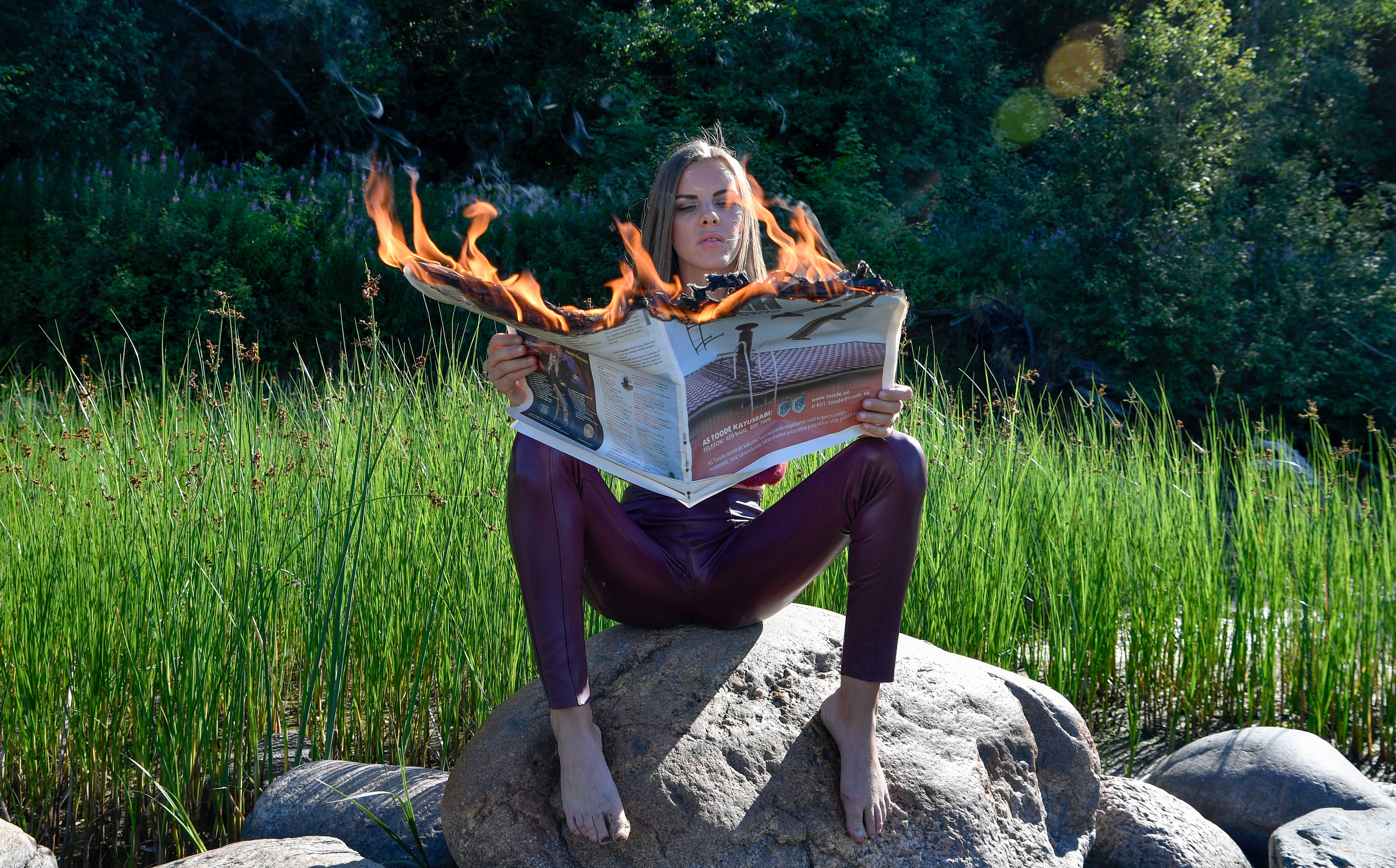 Dramatic Outdoor Art with Burning Newspaper · meta.free_stock.photo