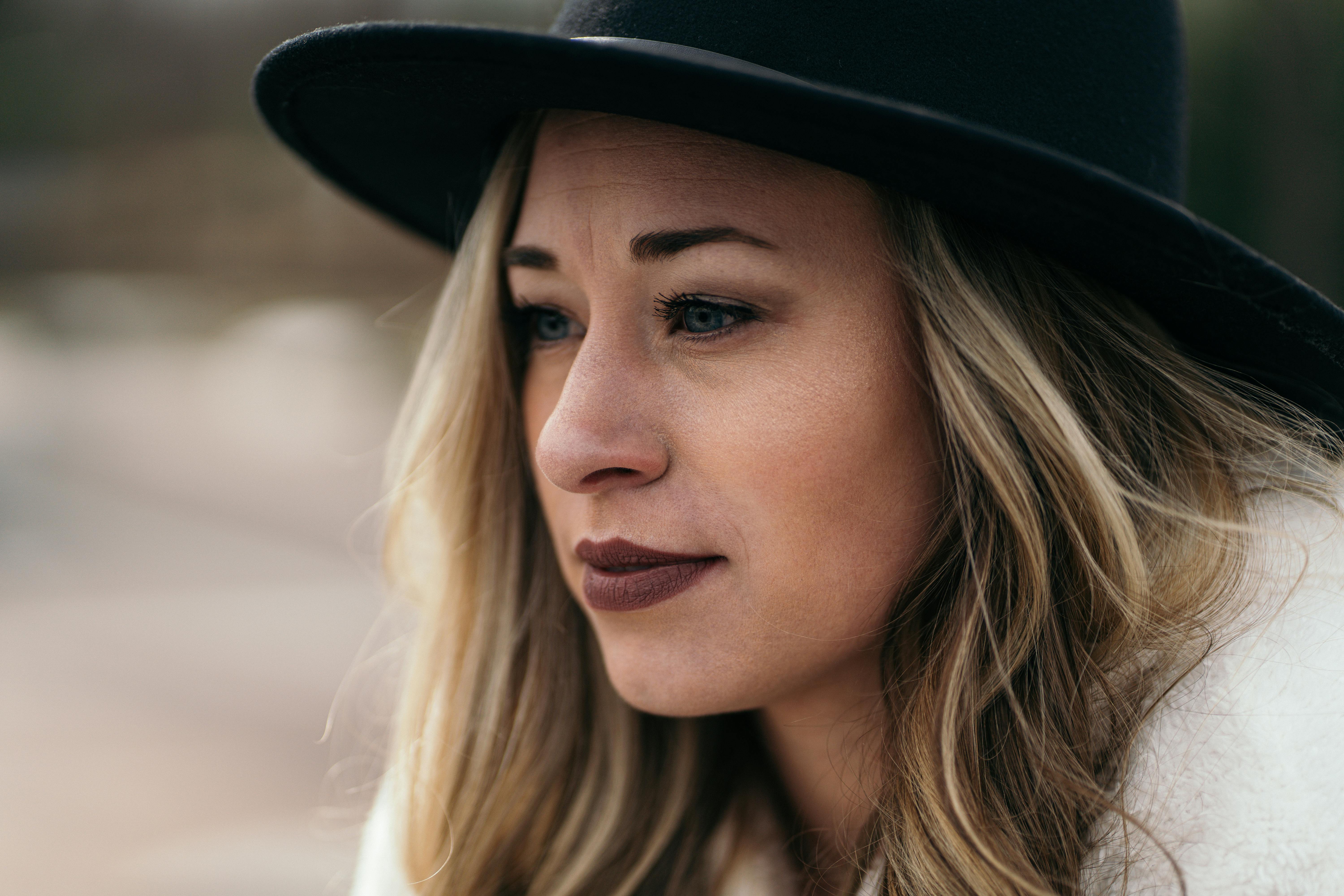 Photo Of Woman Wearing Fedora Hat · Free Stock Photo
