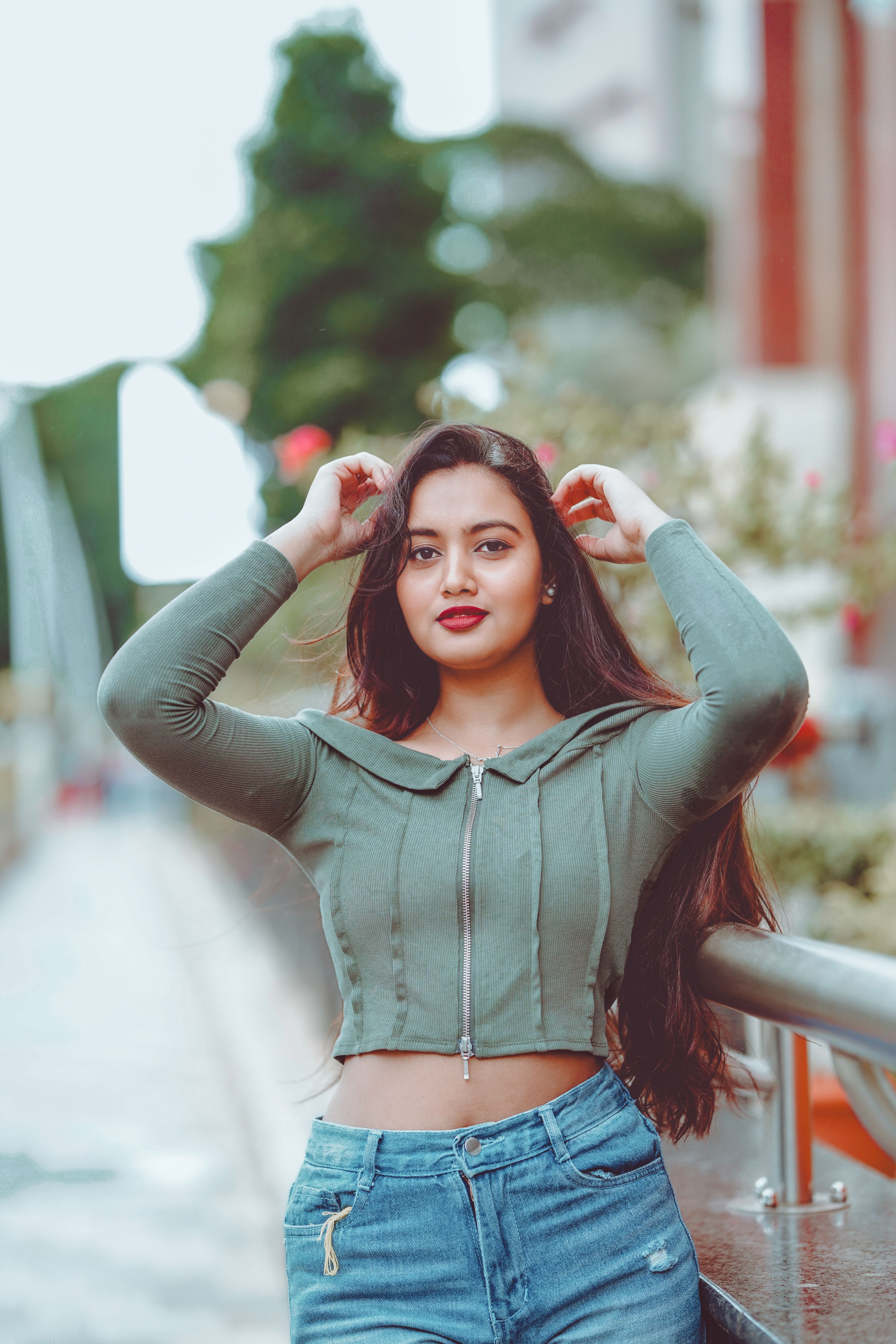 Young woman walking confidently on urban street · Free Stock Photo