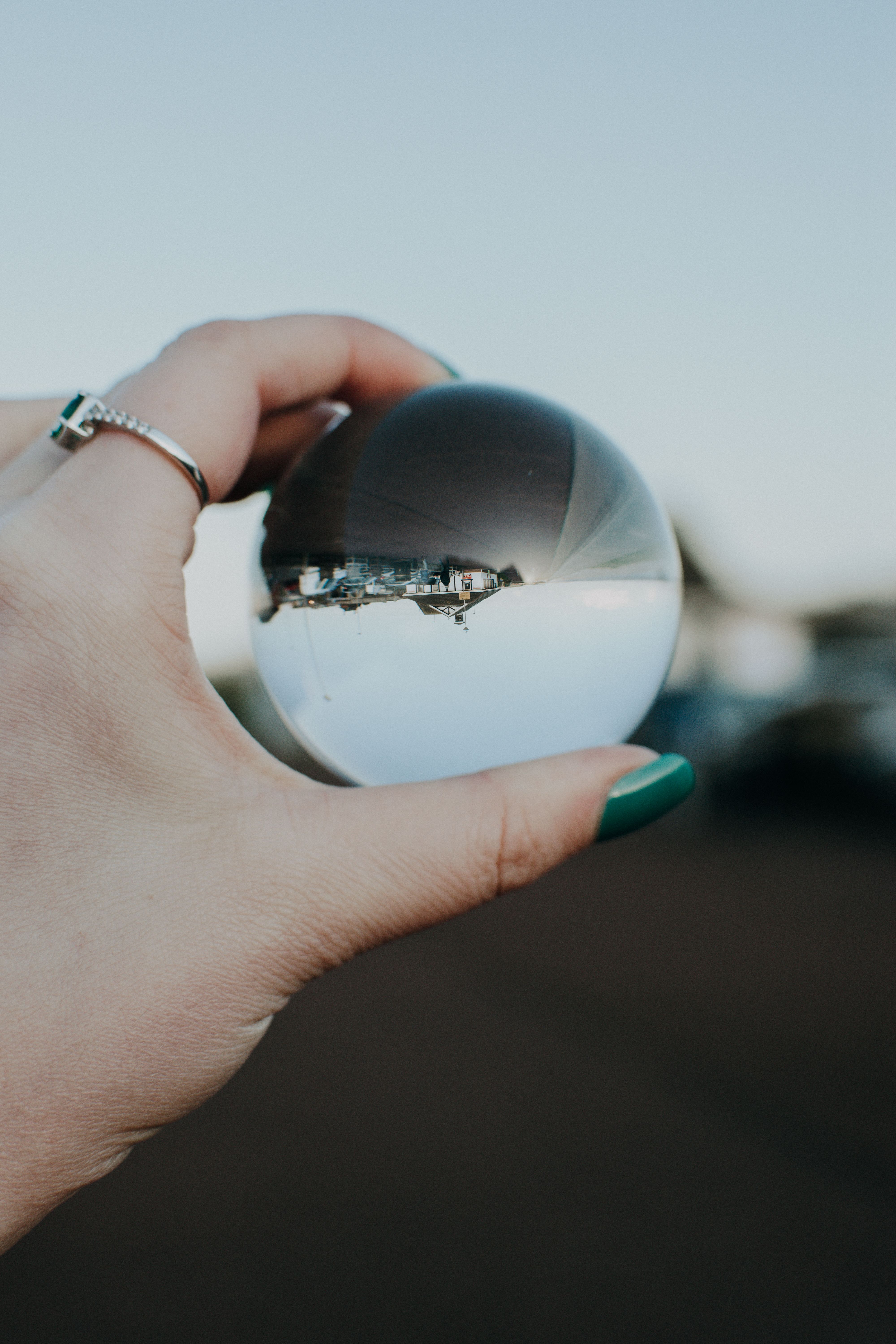 Person Holding Clear Glass Ball · Free Stock Photo