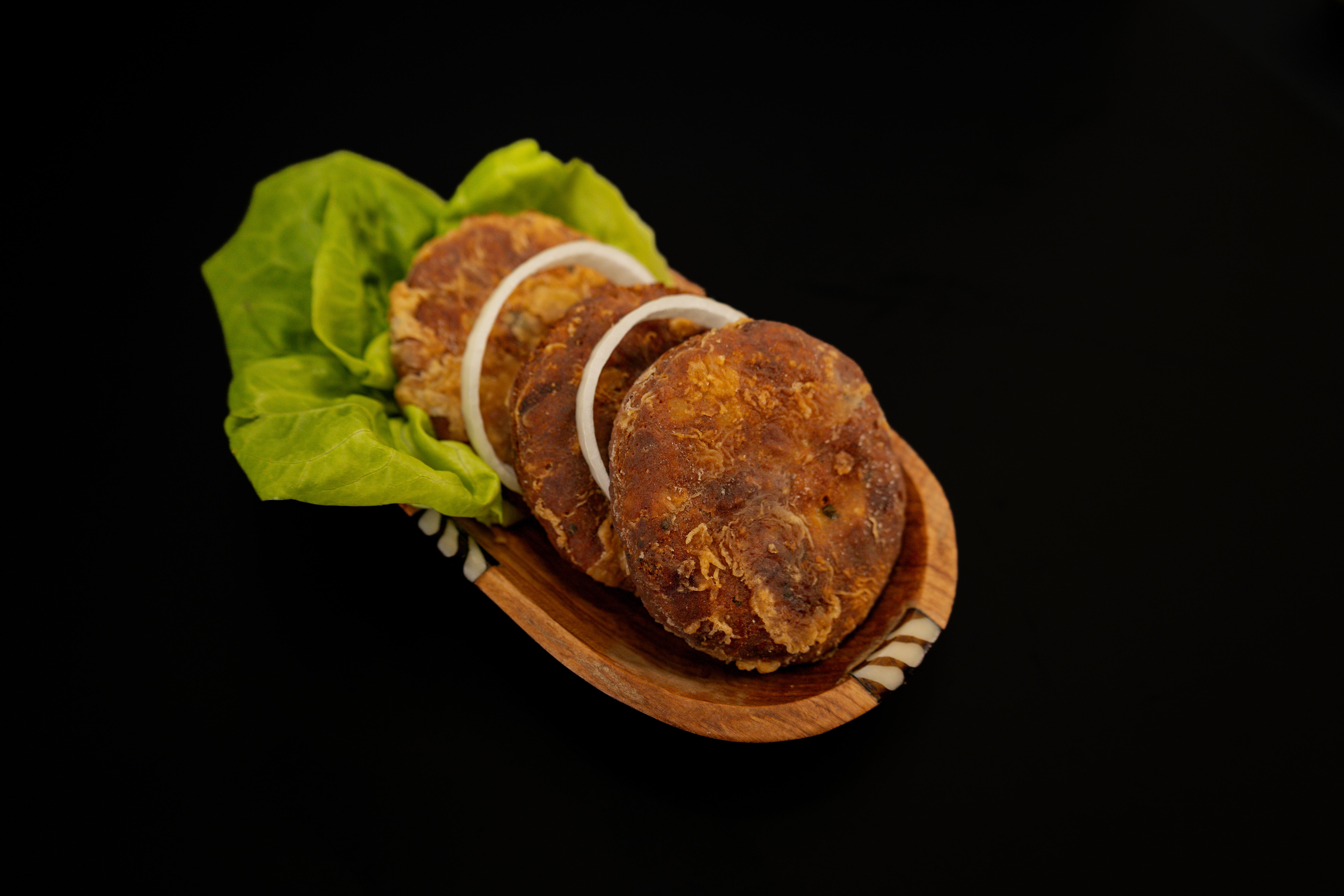 Delicious Patties with Onion and Lettuce on Dark Background · Free ...