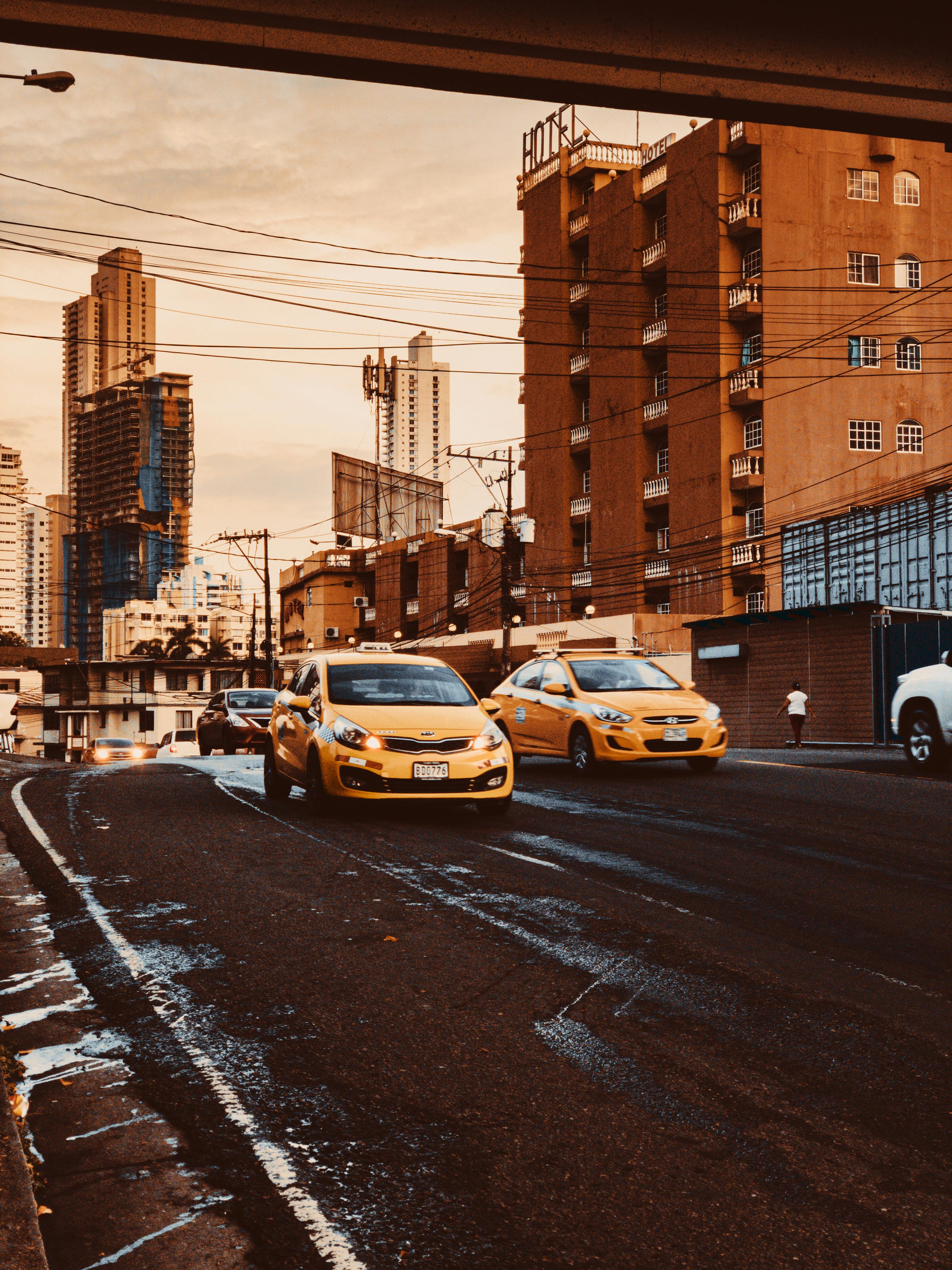 Cars on Road Near High Rise Buildings · Free Stock Photo