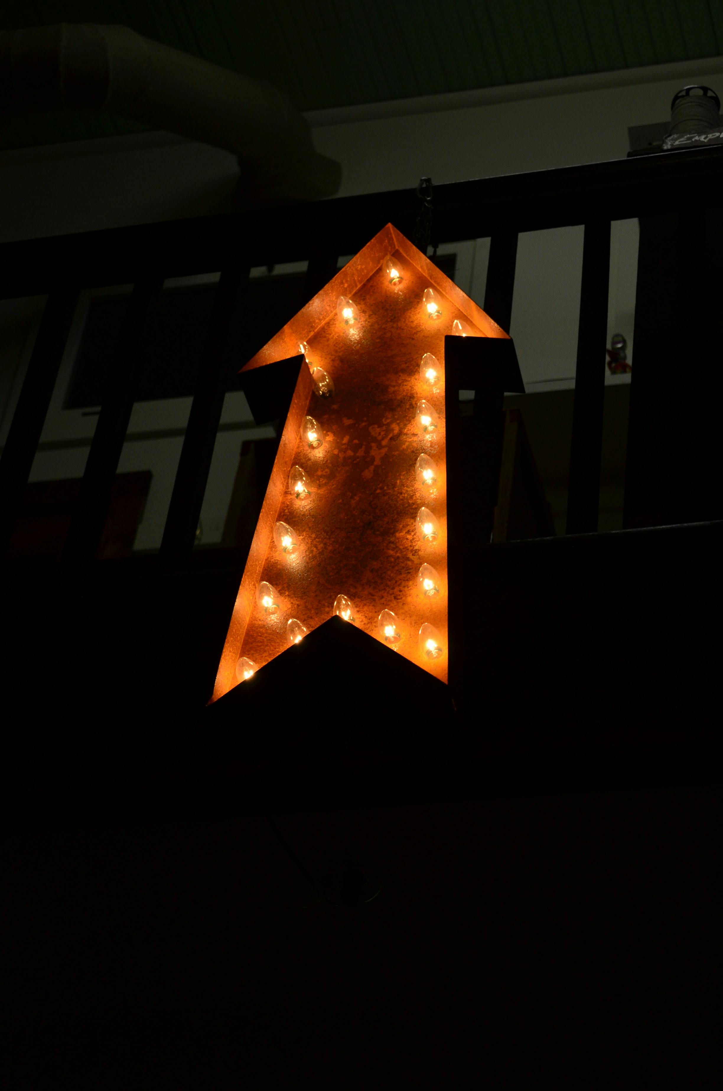 Lighted Brown Arrow Lamp · Free Stock Photo