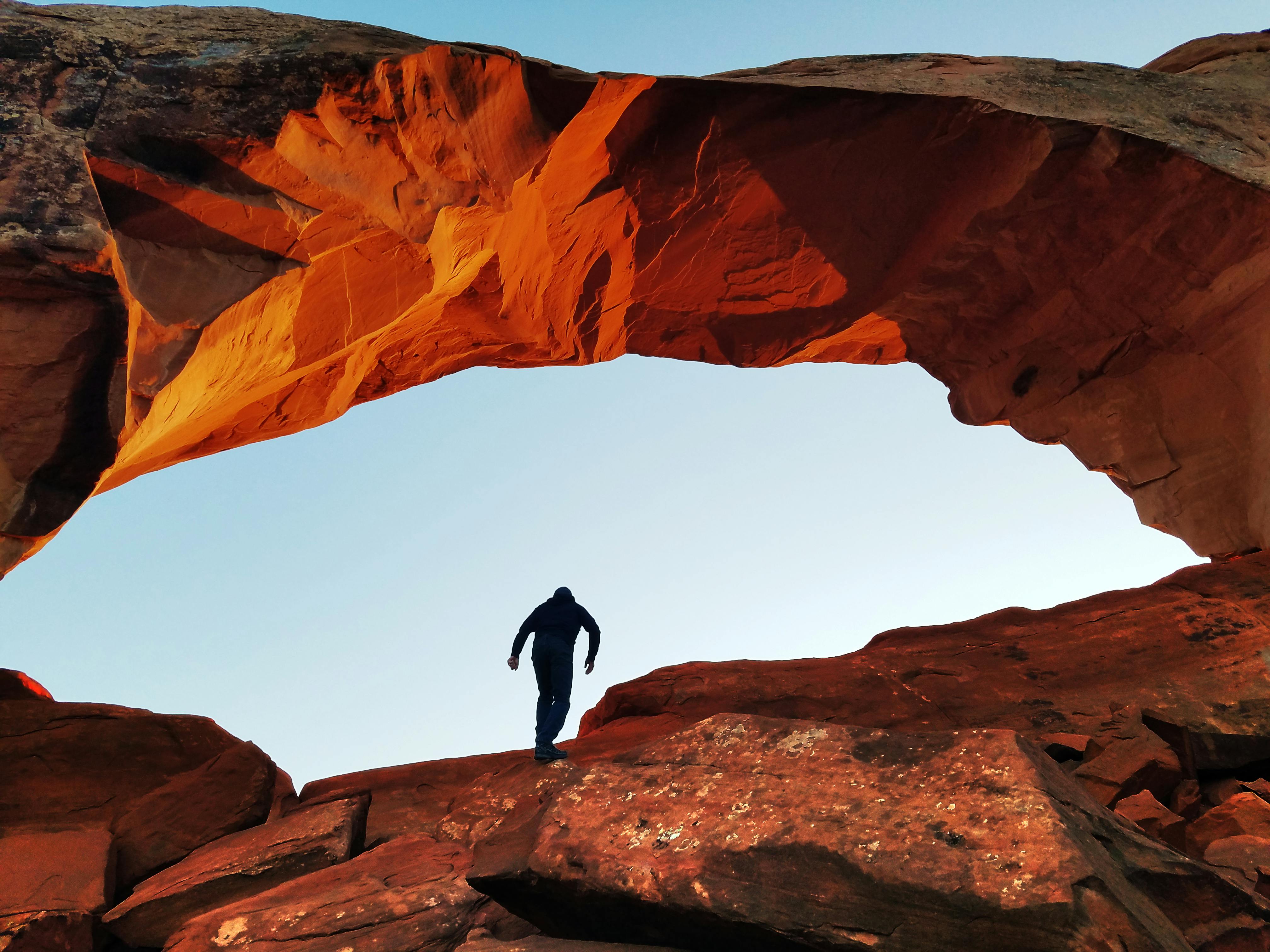 Person Standing on A Rock Formation · Free Stock Photo