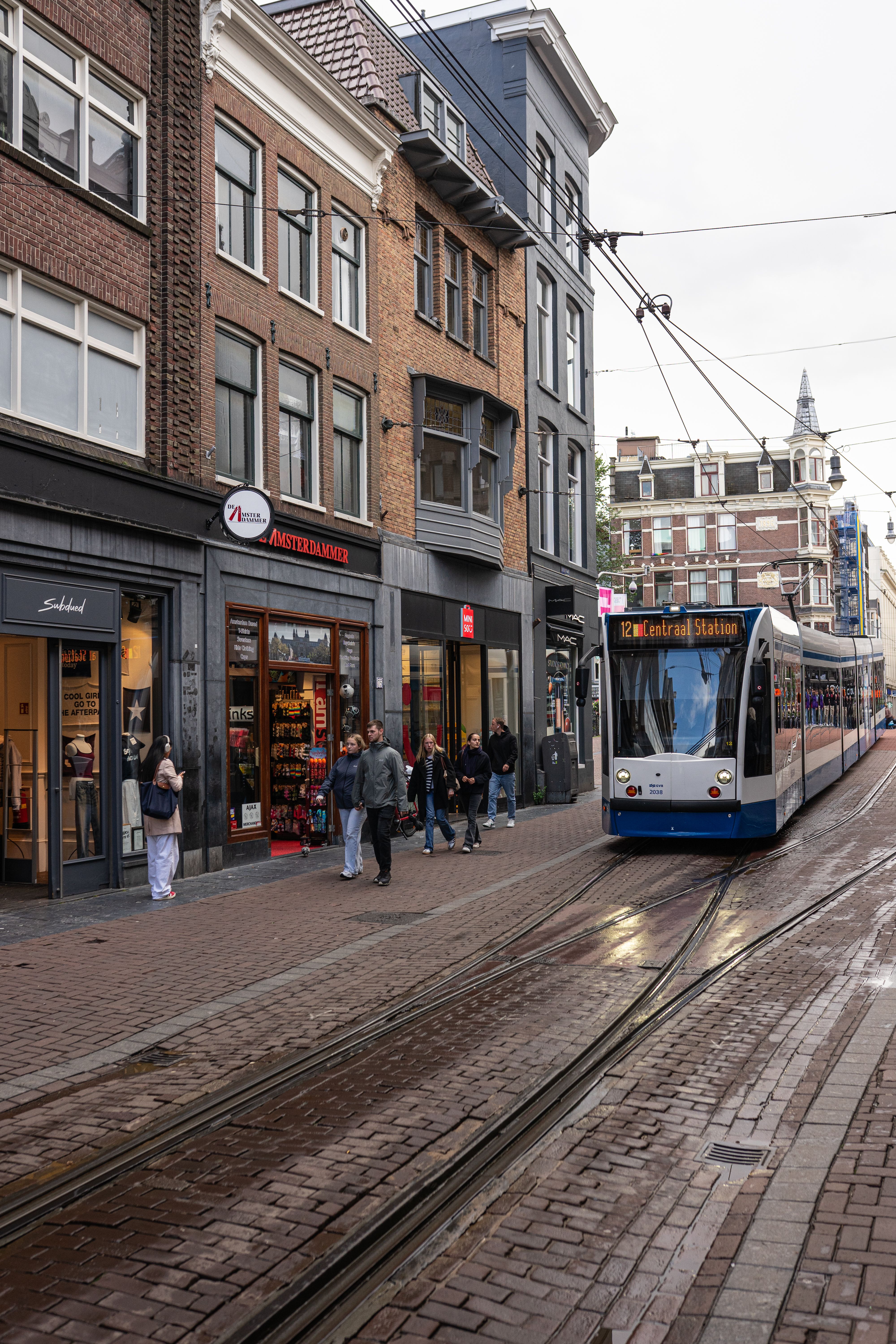 Tram on a Bustling Amsterdam Street · Free Stock Photo