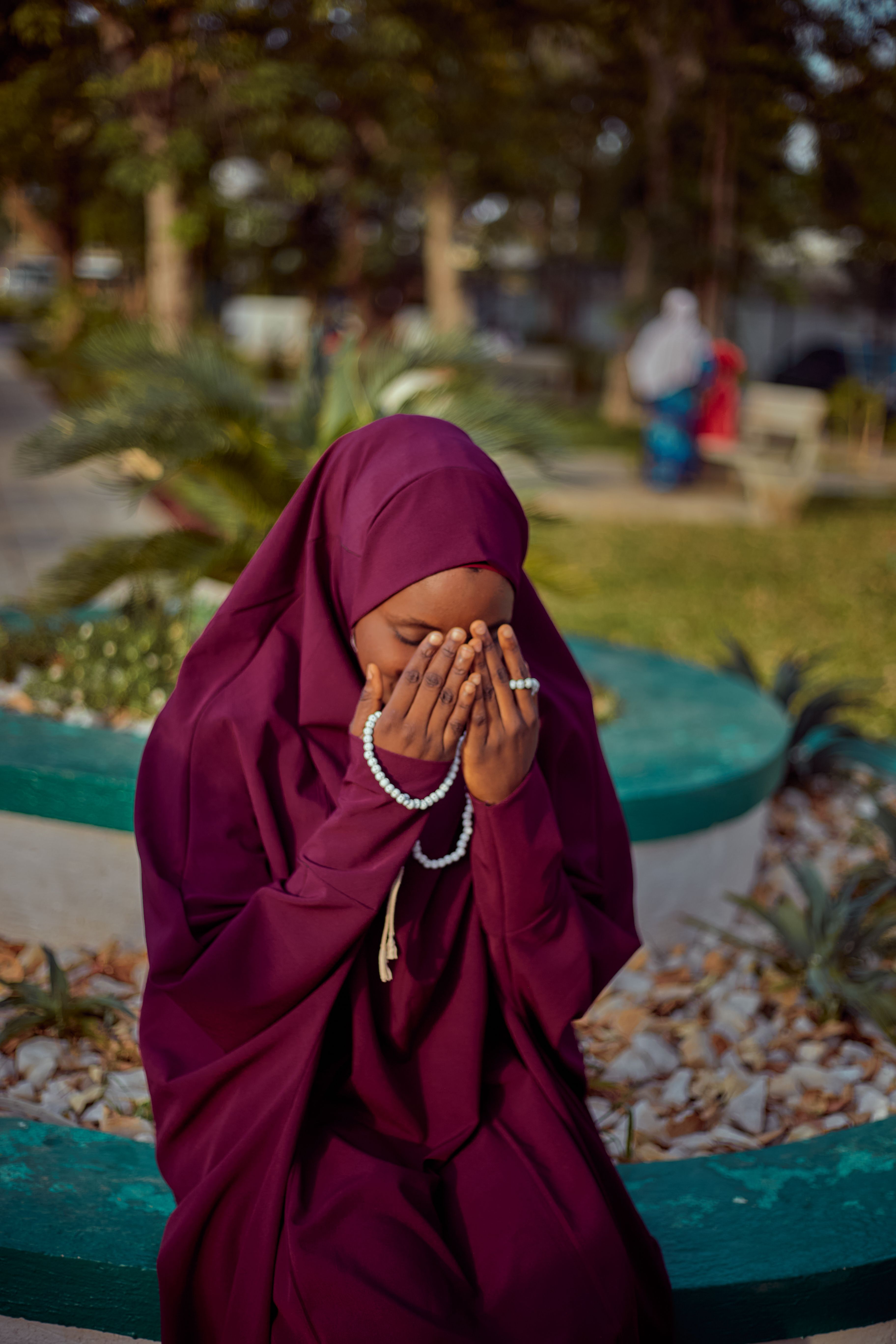 Woman Praying in Garden Setting Outdoors · Free Stock Photo