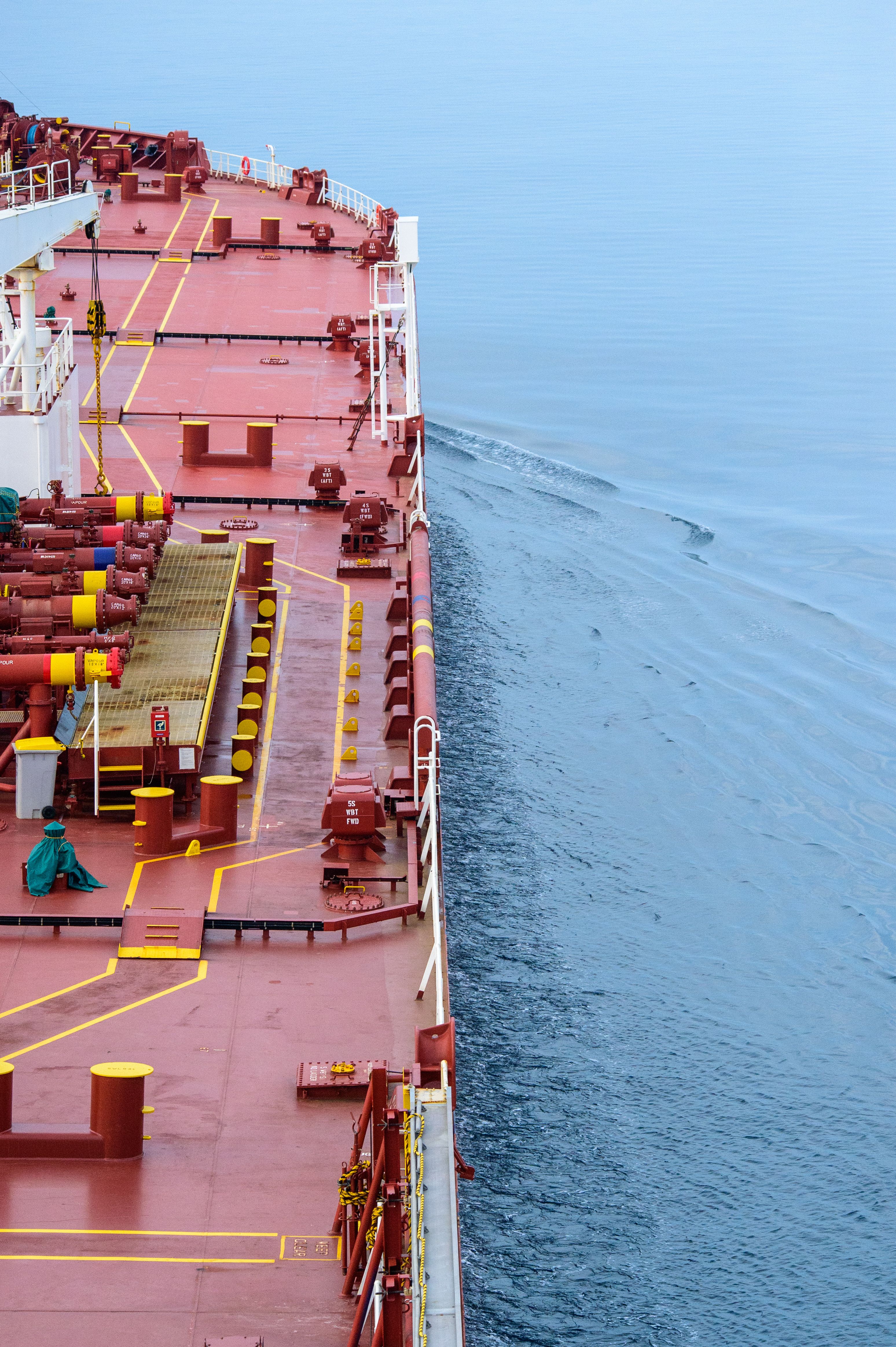 Cargo Ship Navigating Calm Blue Waters · Free Stock Photo