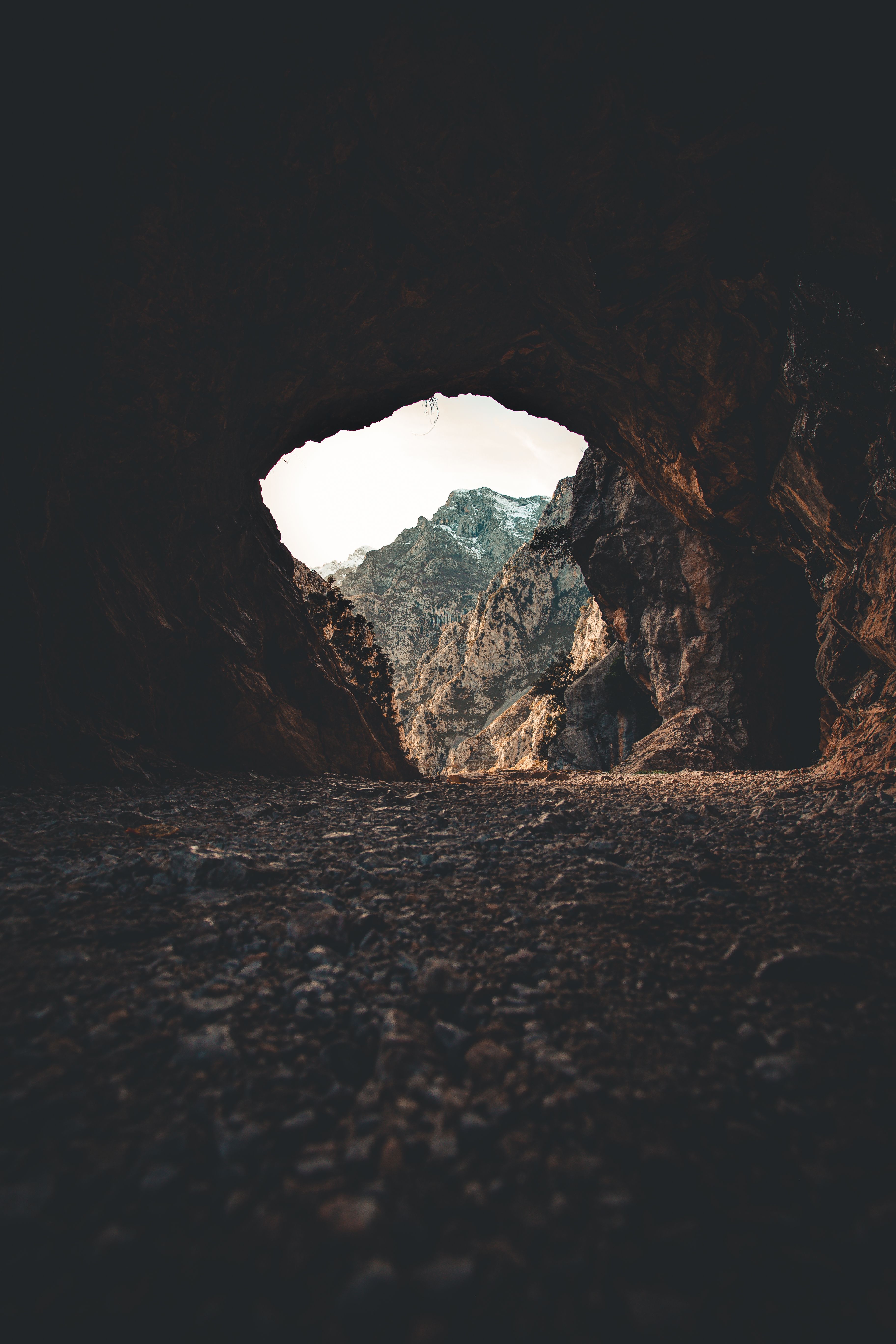 Picturesque cave between mounts in daylight · Free Stock Photo