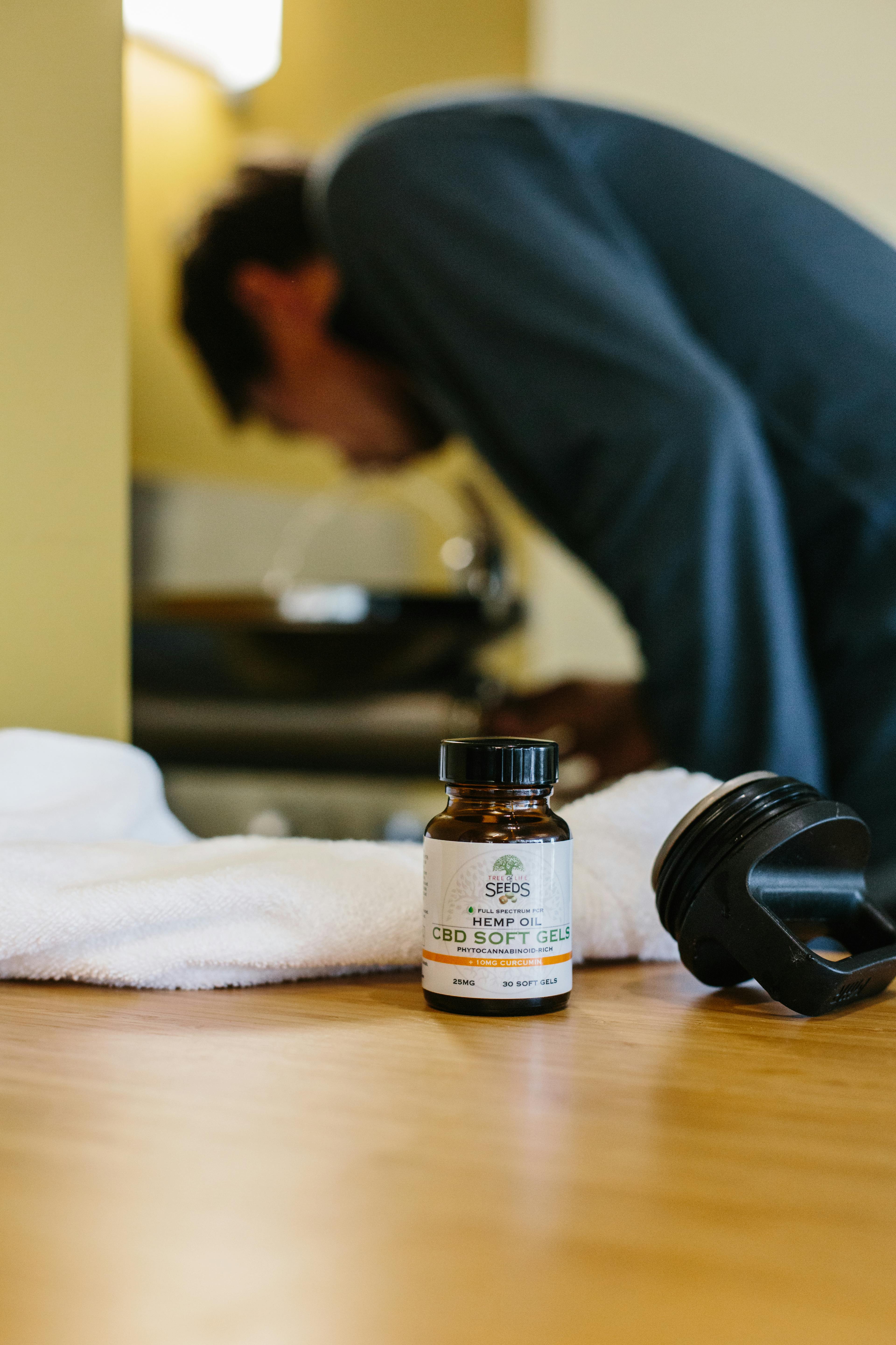 Orange and CBD Product Beside Plant · Free Stock Photo