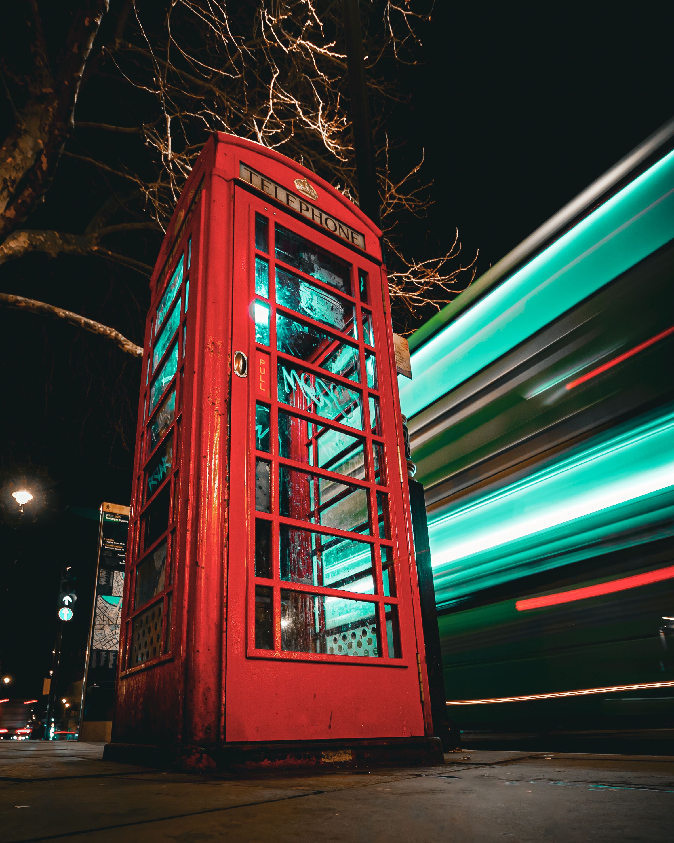 Iconic Red Telephone Booth at Night · Free Stock Photo