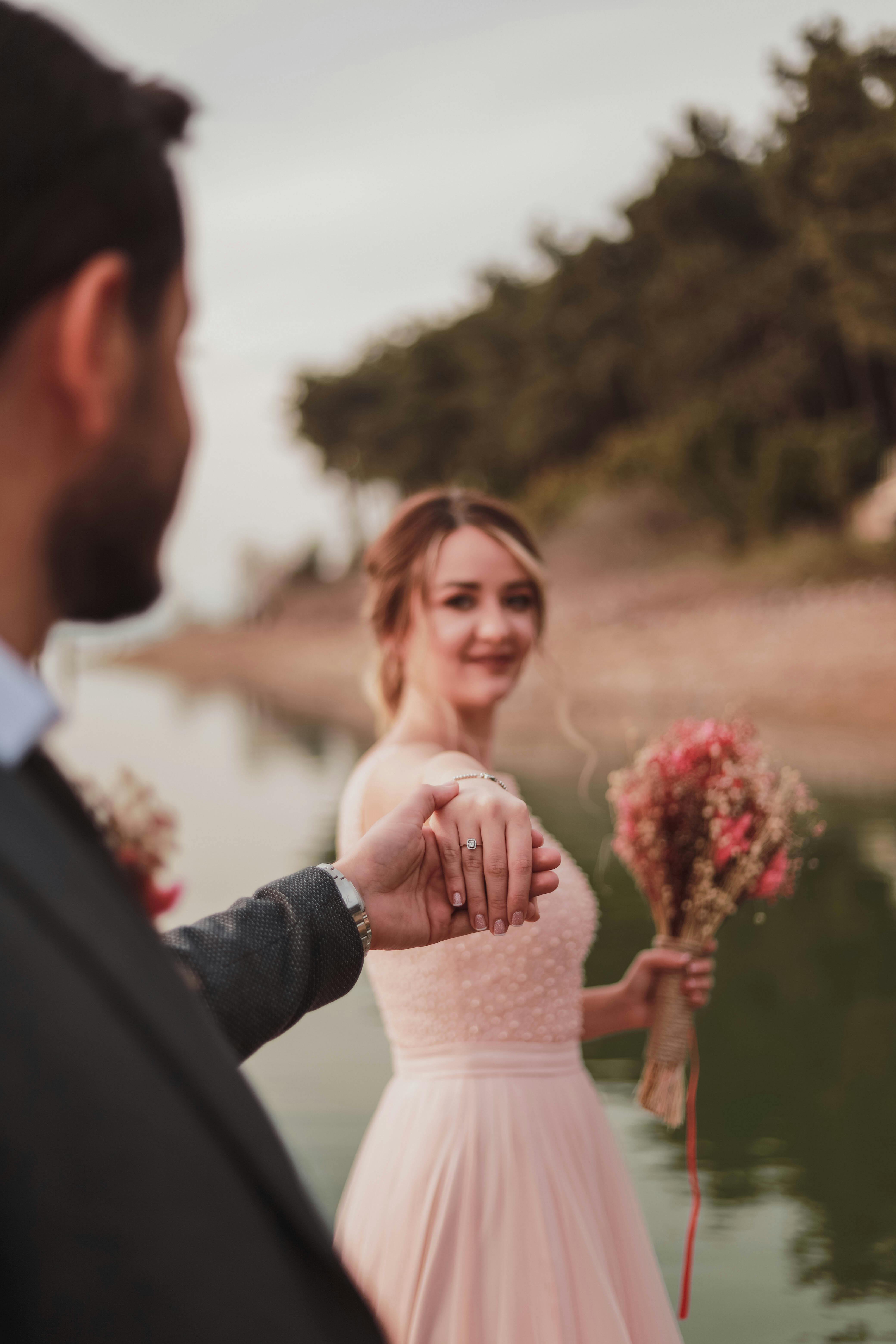 A Couple Dancing Near A Body Of Water · Free Stock Photo