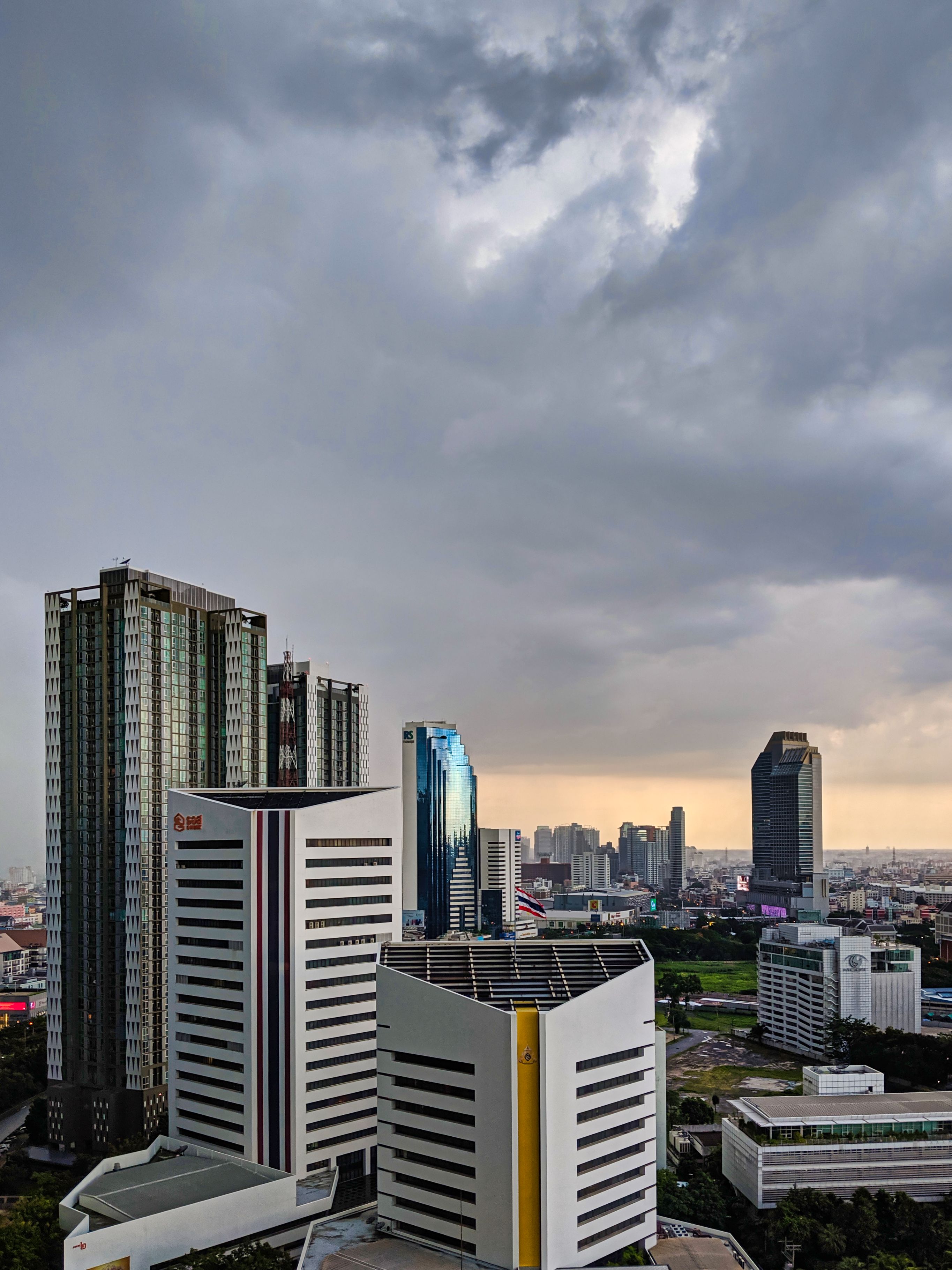 City Skyline Under Gray Cloudy Sky · Free Stock Photo