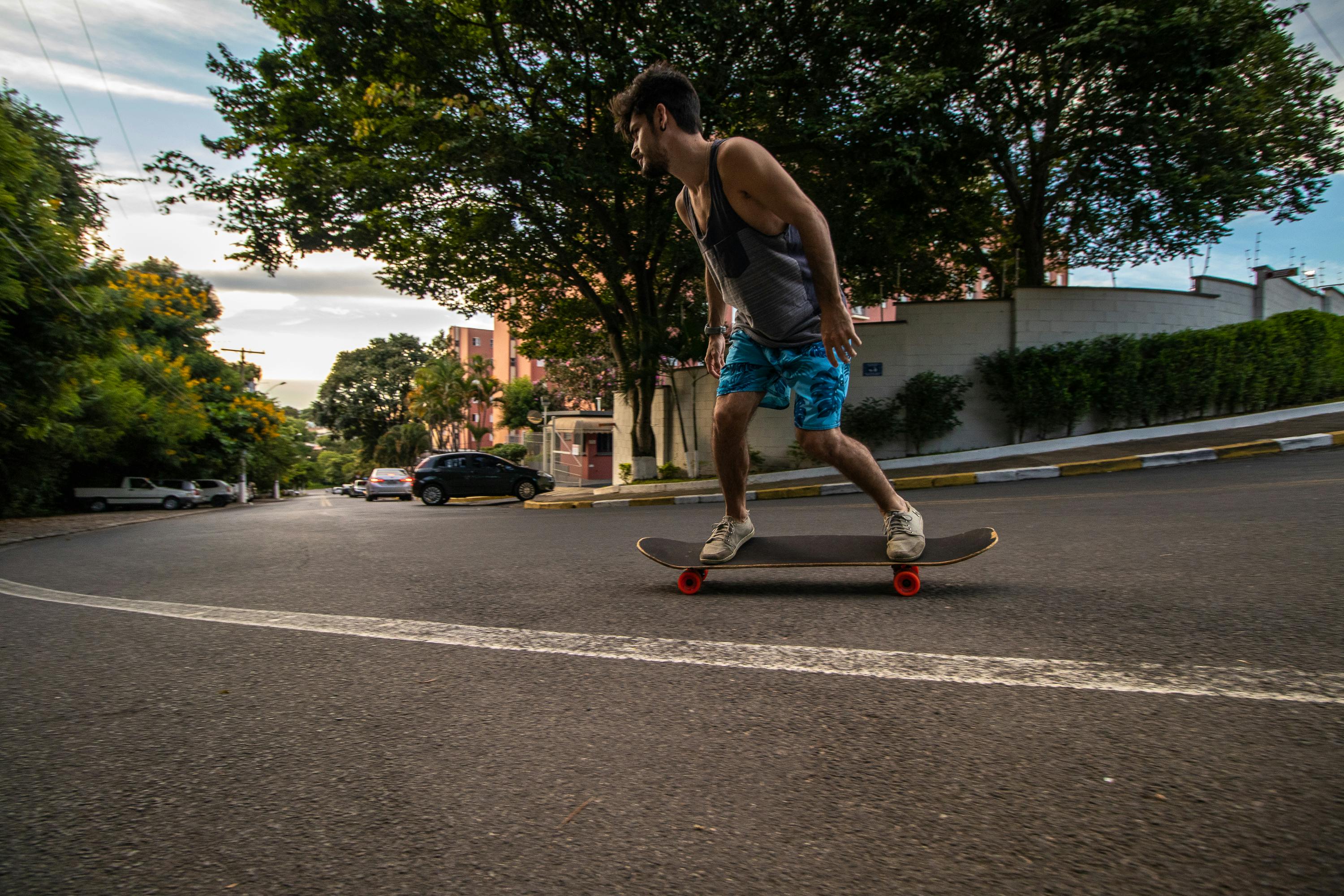 Man Skateboarding in Road · Free Stock Photo