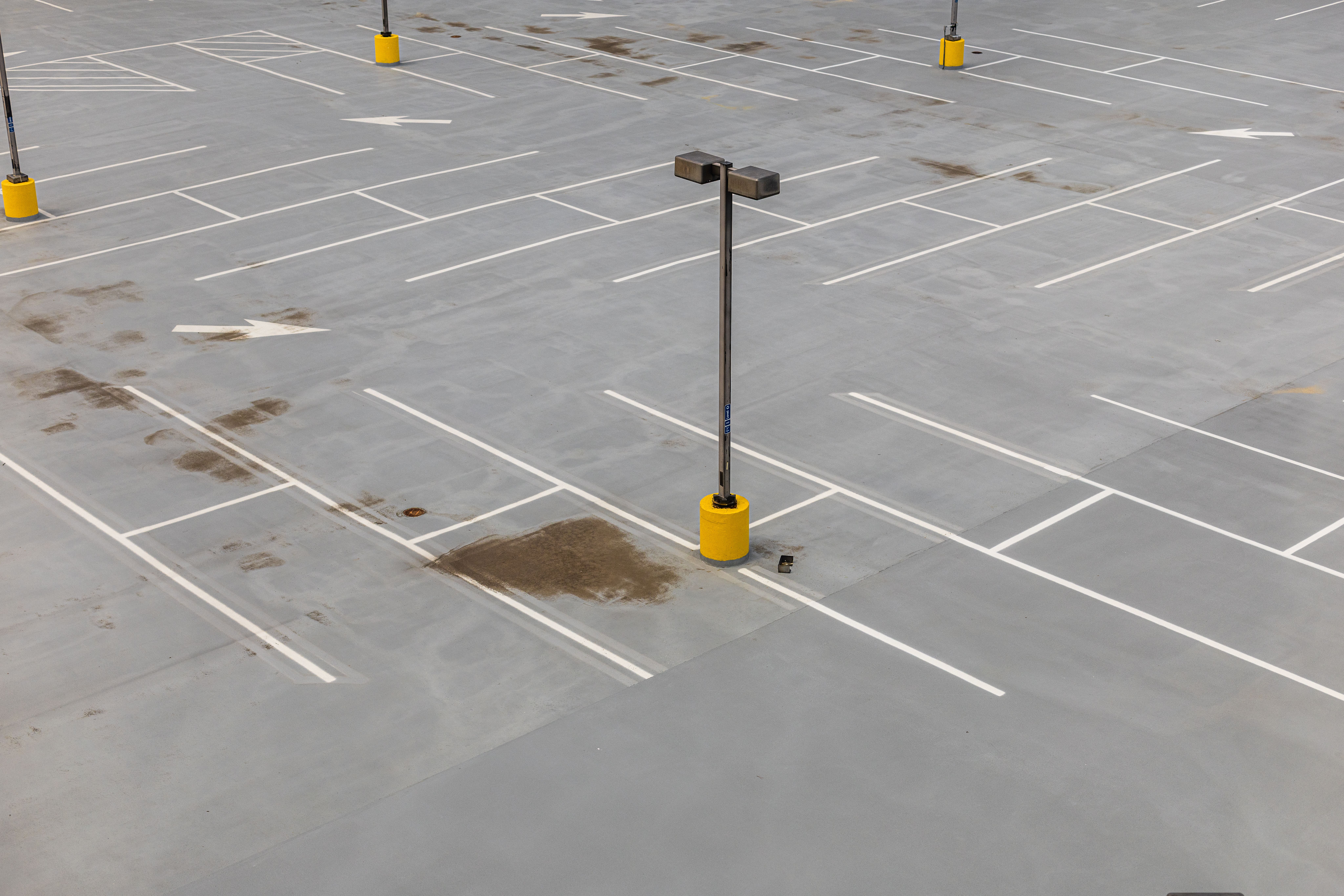 Empty Urban Parking Lot Design with Lamp Posts · Free Stock Photo