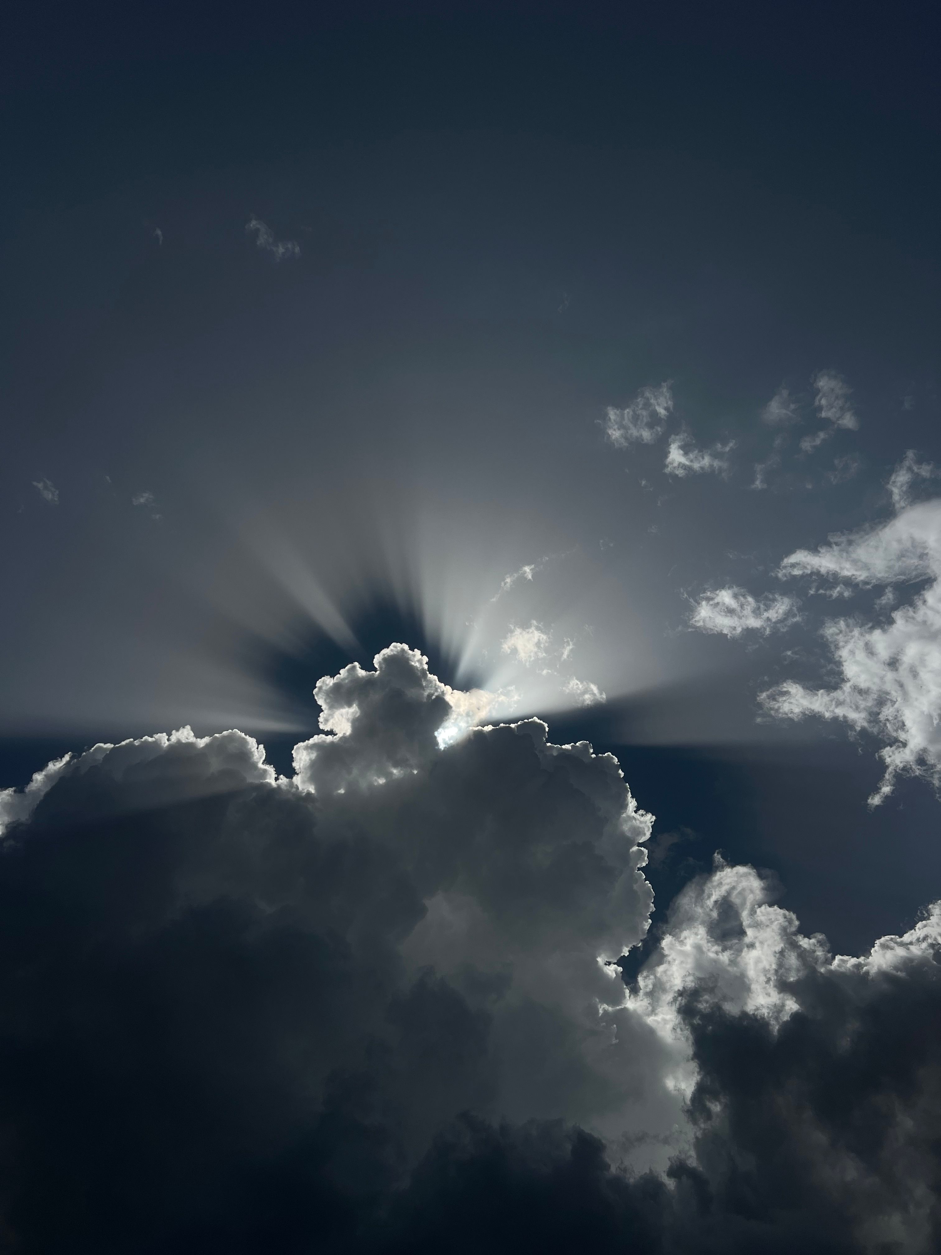 Dramatic Sun Rays Breaking Through Storm Clouds · Free Stock Photo