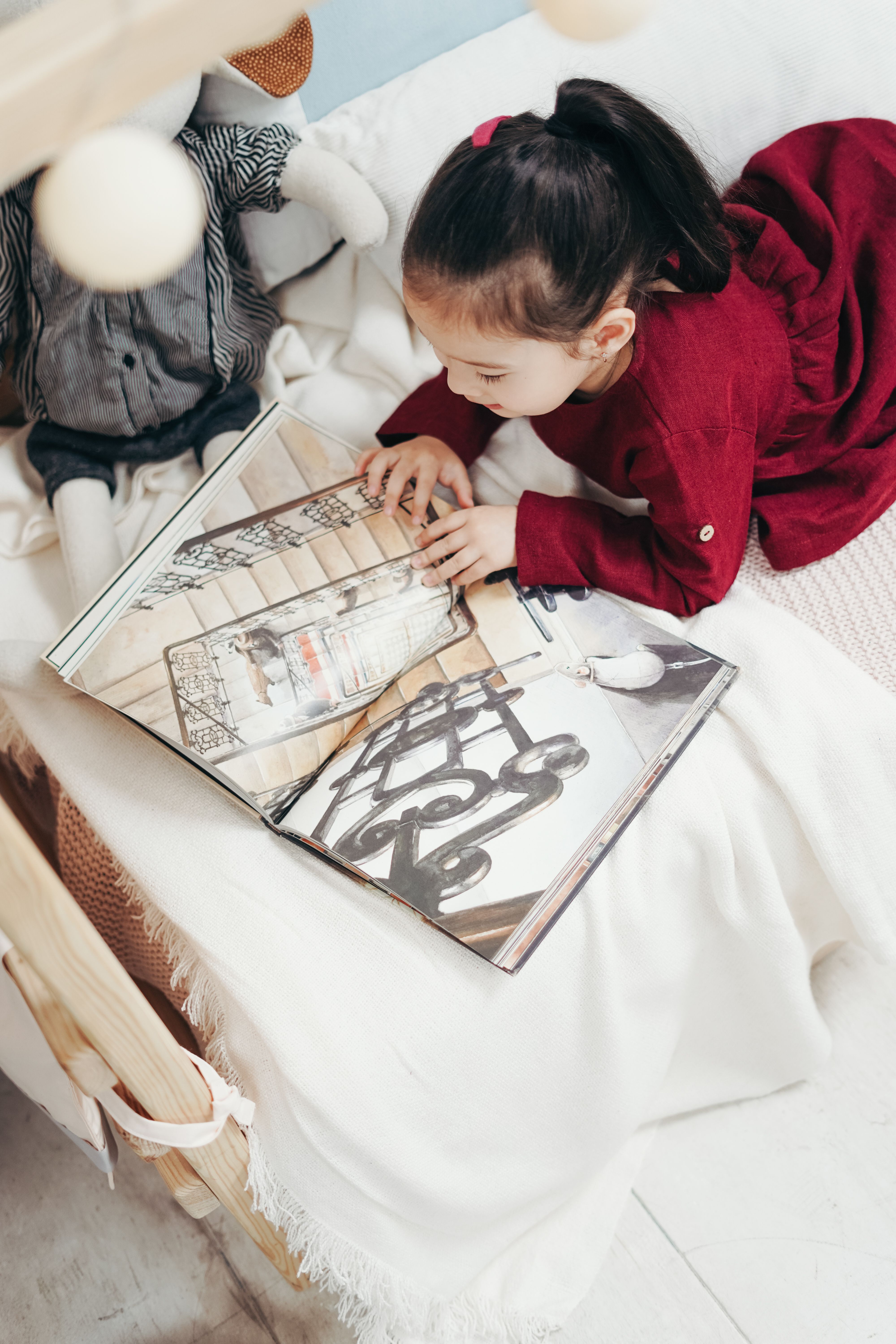 Girl in Red Long Sleeve Dress Reading Book · Free Stock Photo