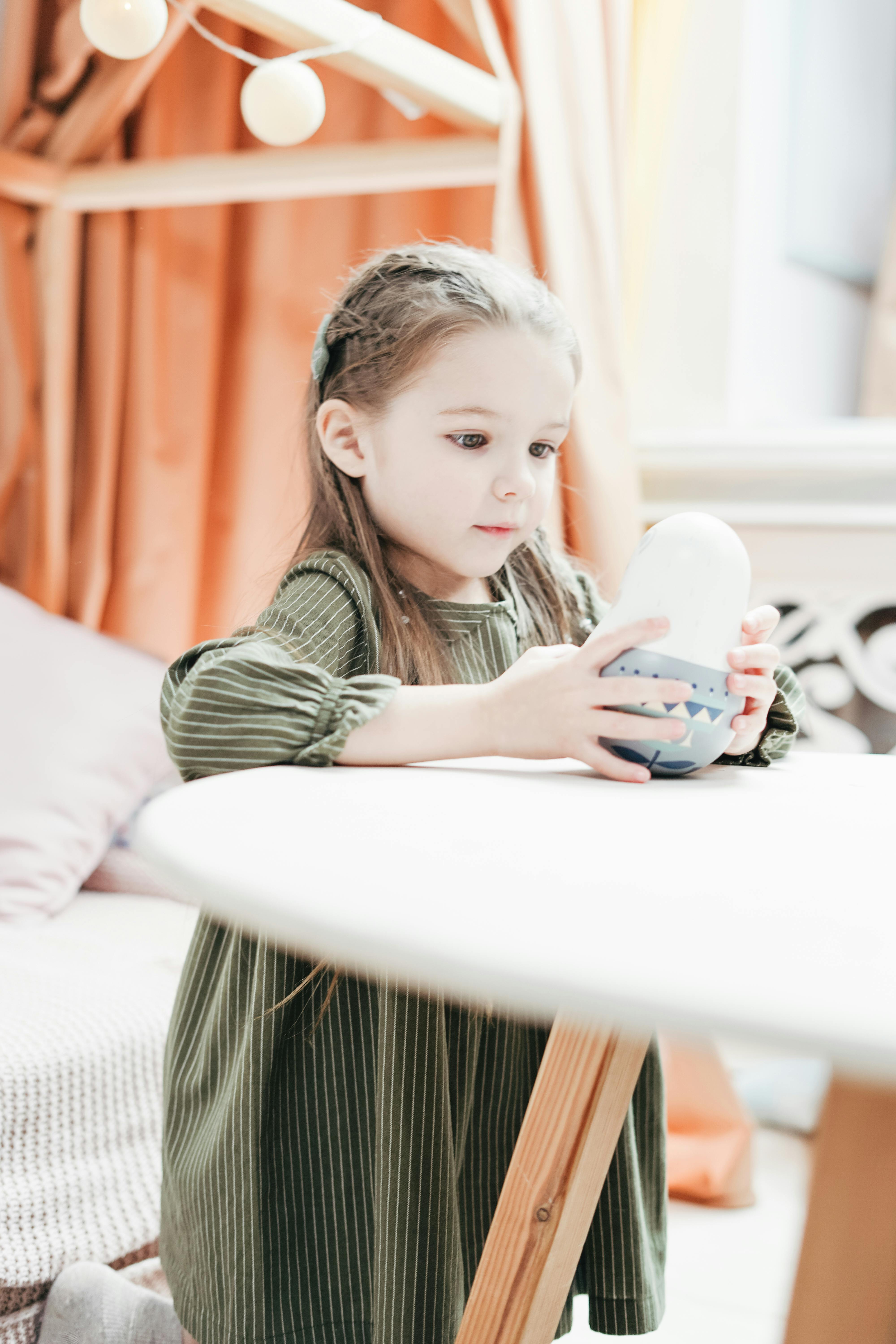 A Little Girl Playing Makeup · Free Stock Photo