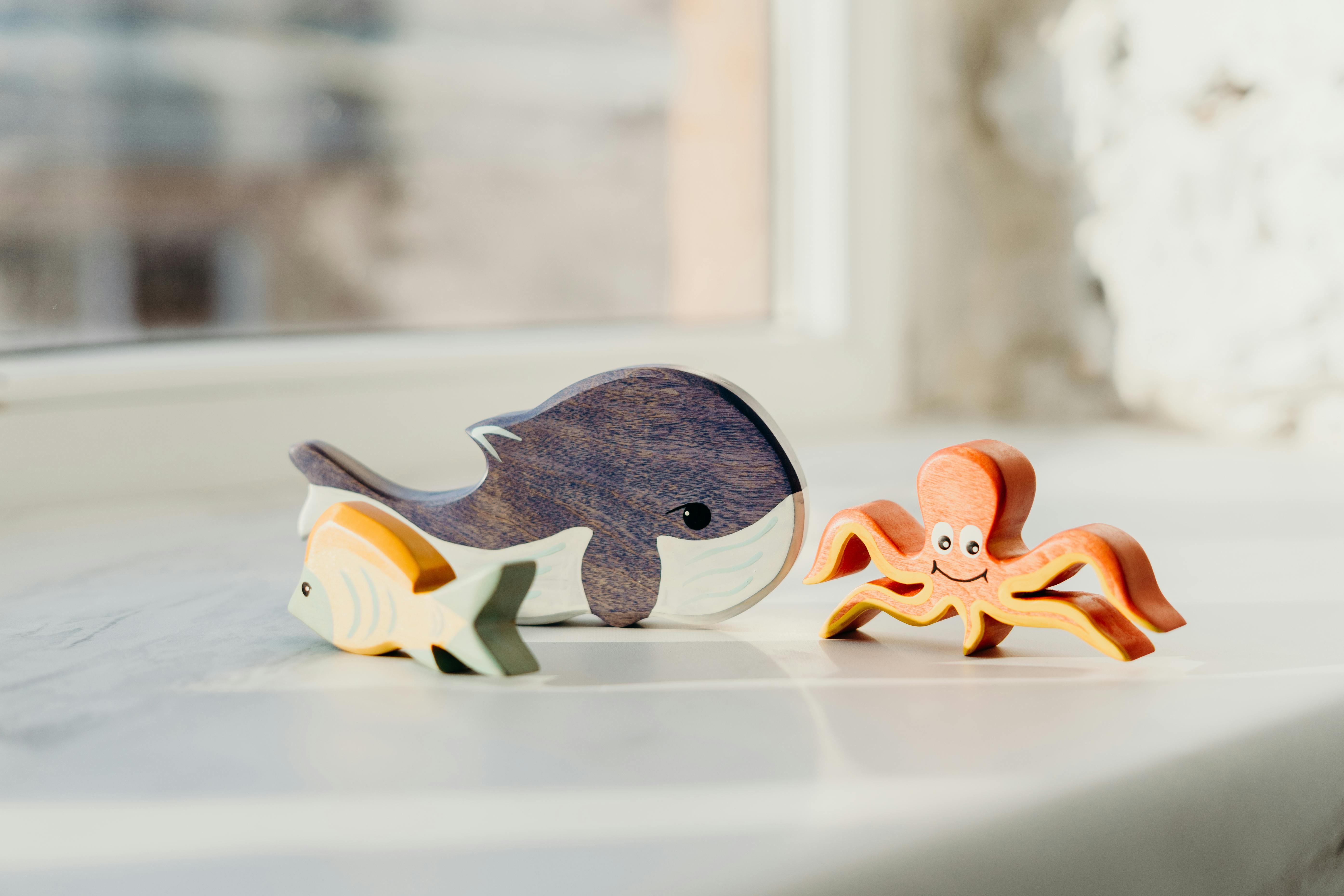 Green and Orange Wooden Fish Toy · Free Stock Photo
