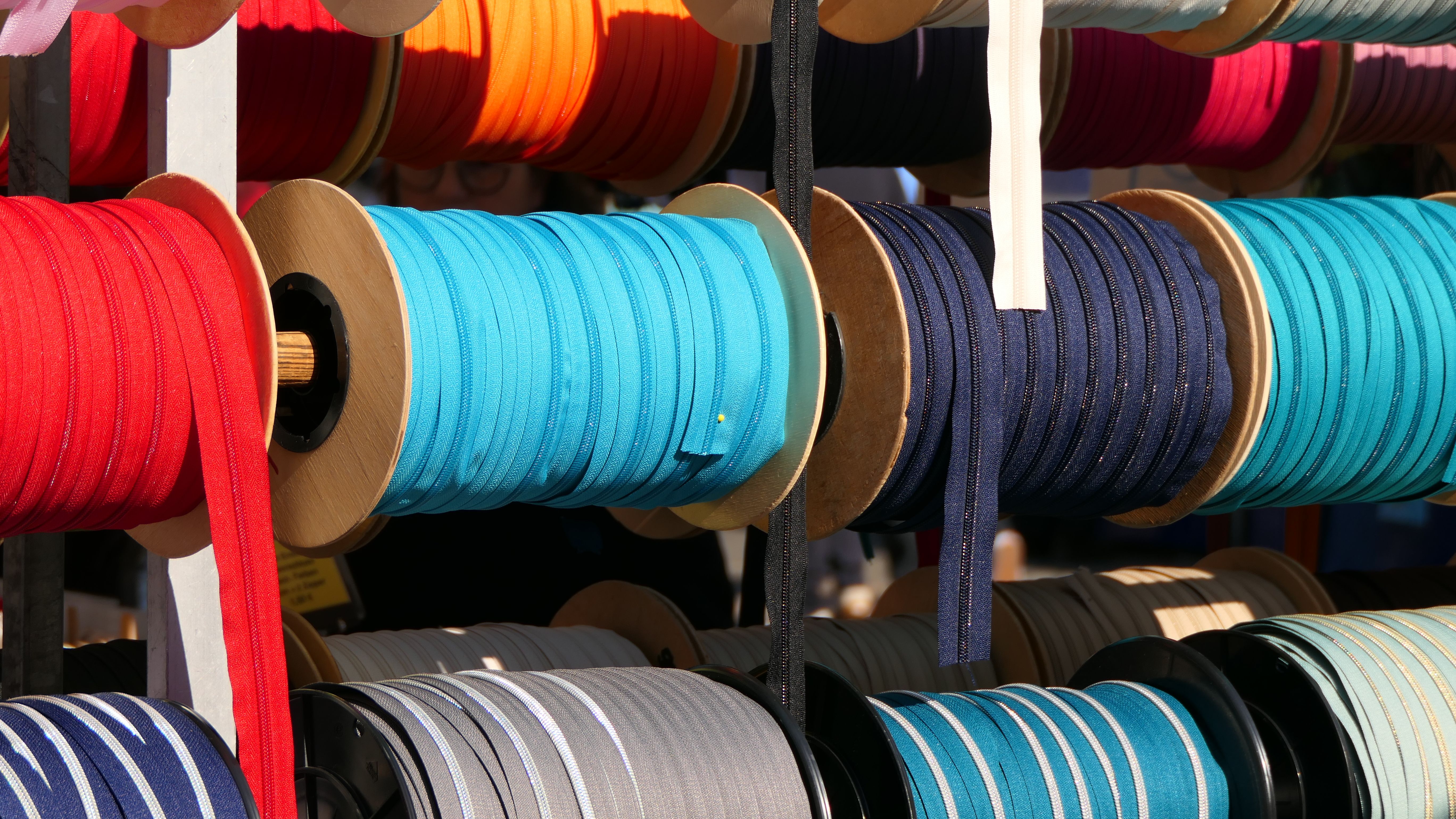 Colorful Display of Textile Spools in Mayen Market · Free Stock Photo