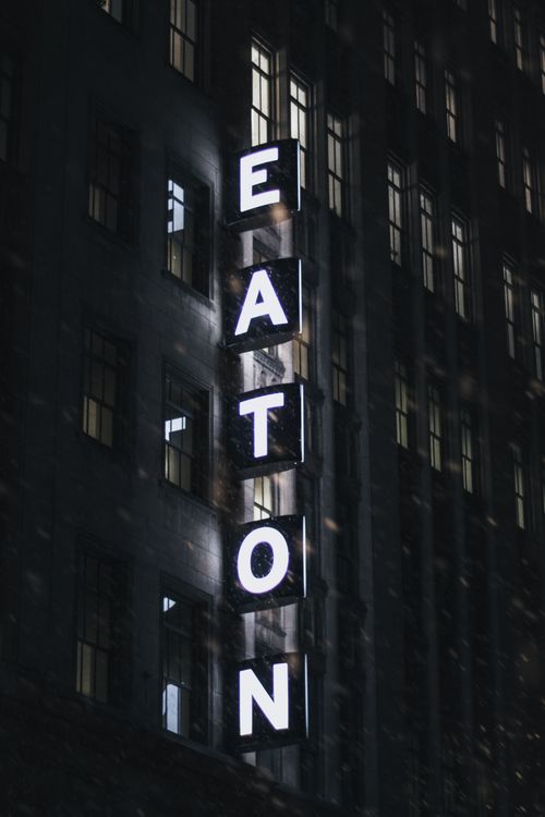 Eaton Building Sign at Night with Snowflakes · Free Stock Photo