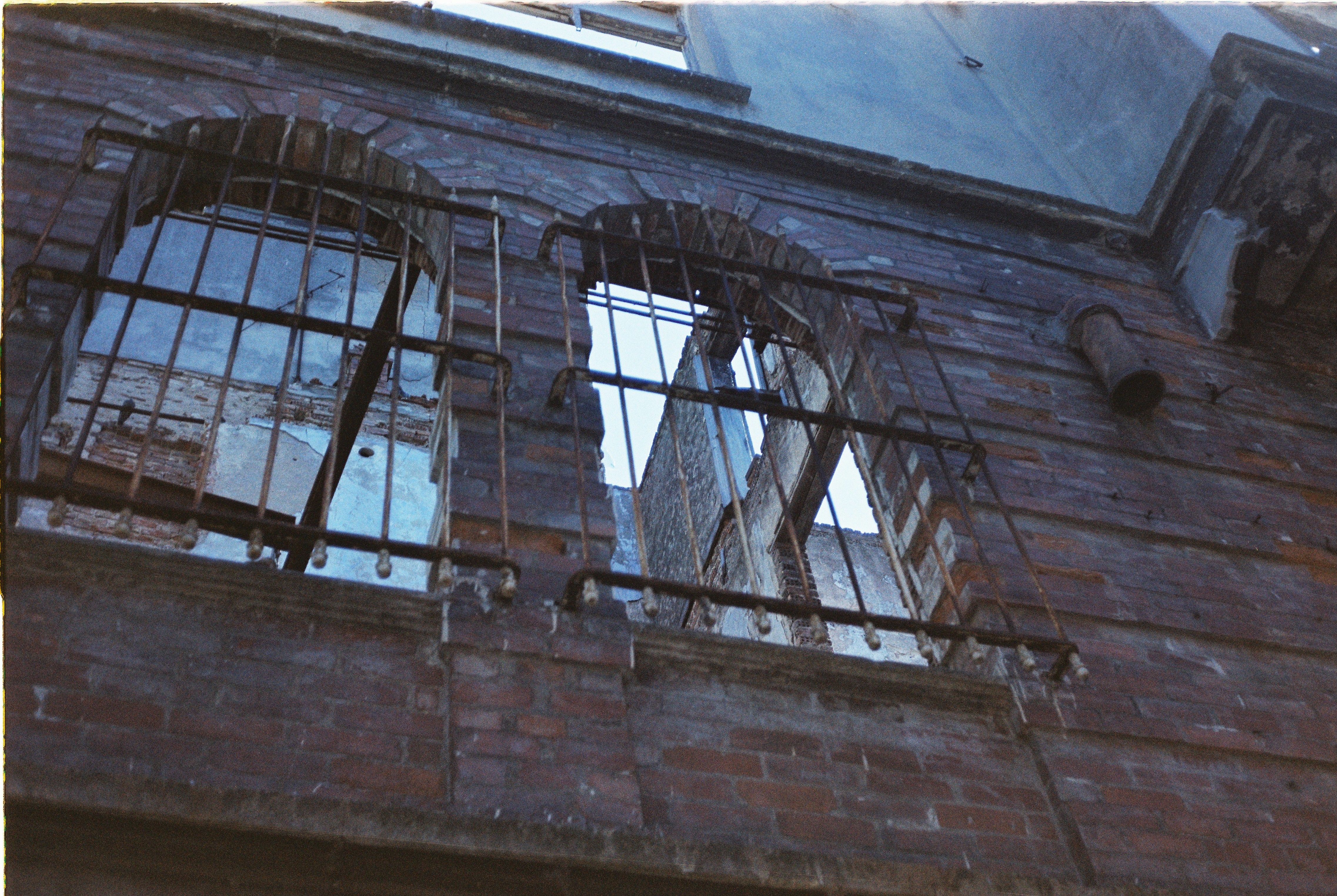 Vintage Brick Architecture with Barred Windows · Free Stock Photo