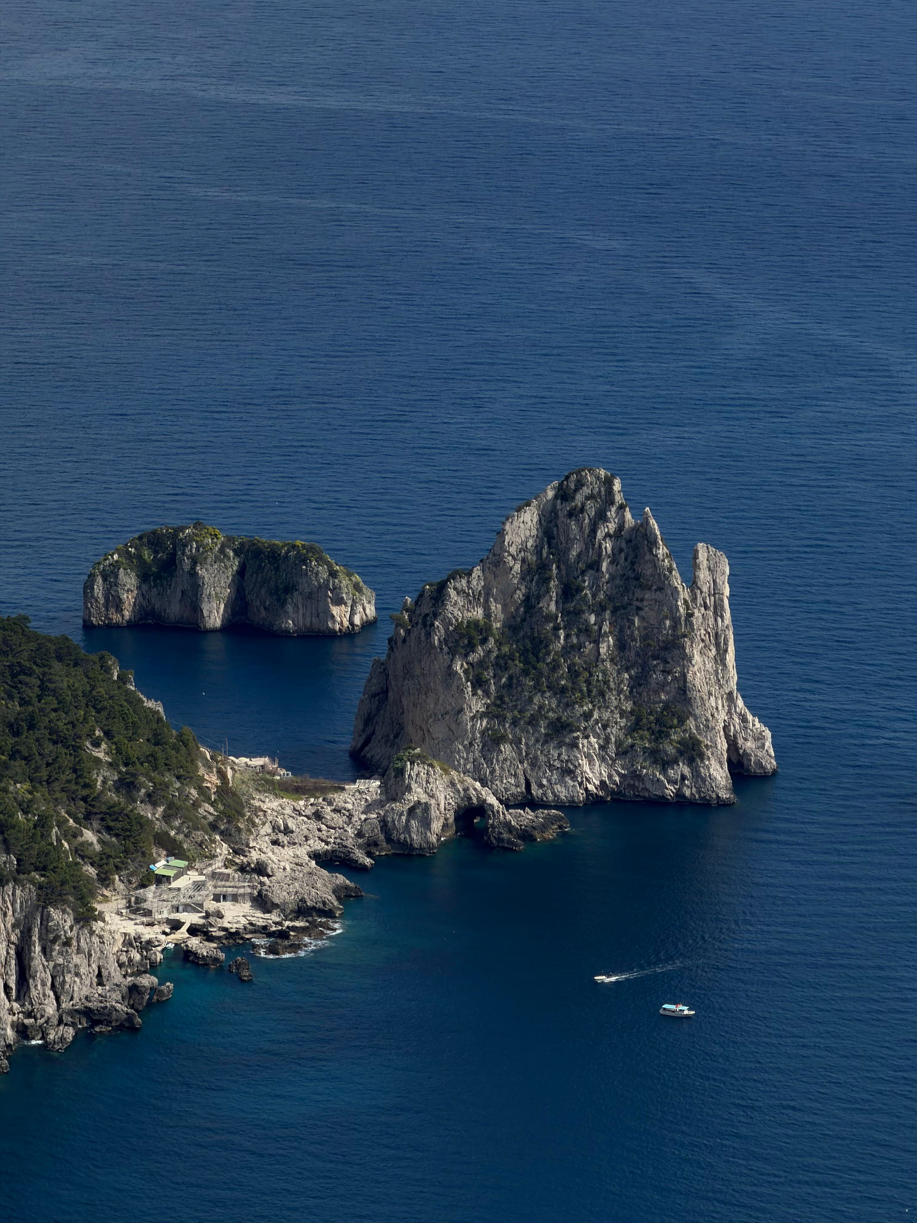 Breathtaking Aerial View of Capri's Faraglioni Rocks · Free Stock Photo