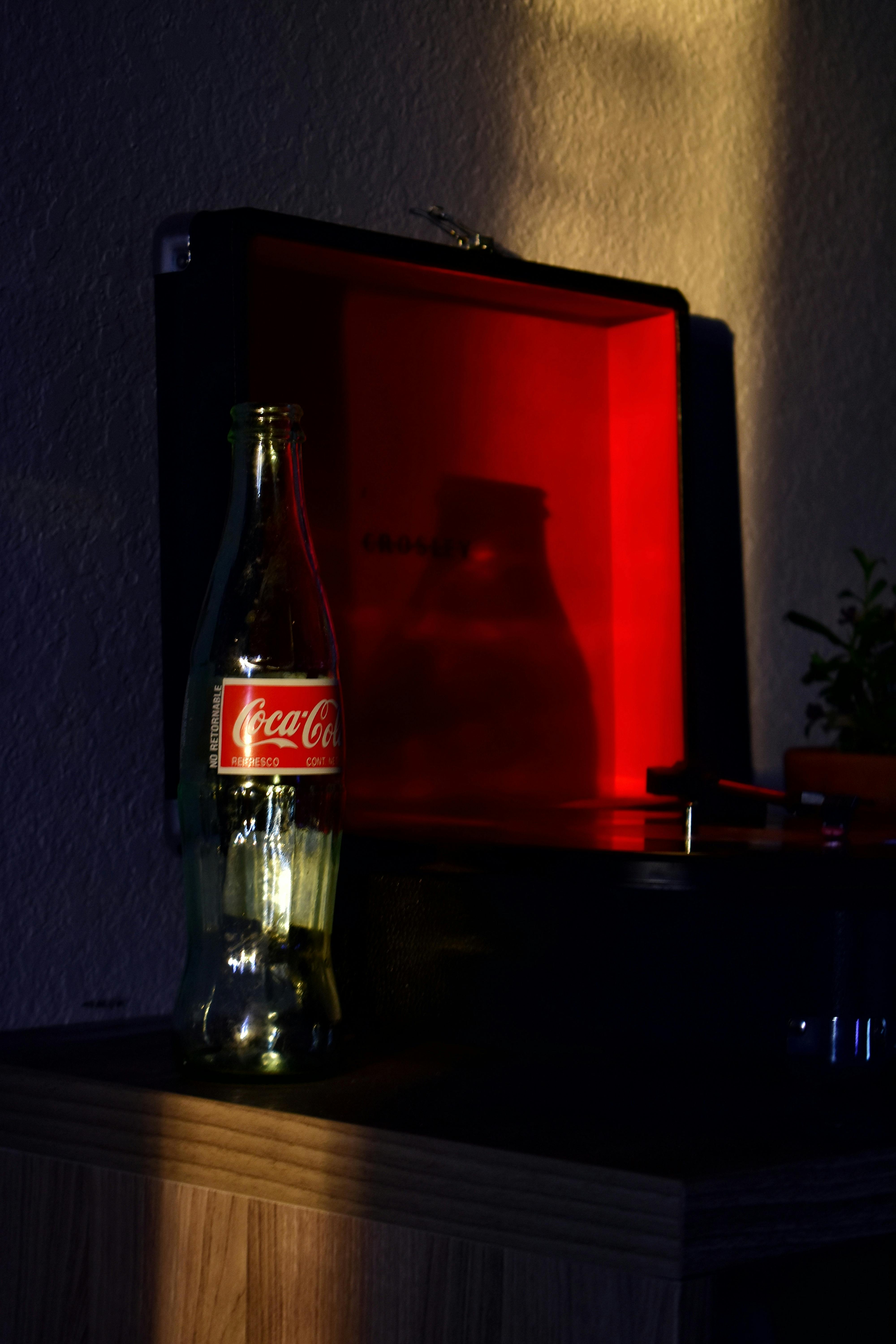 Three White and Brass Coca-cola Bottles · Free Stock Photo