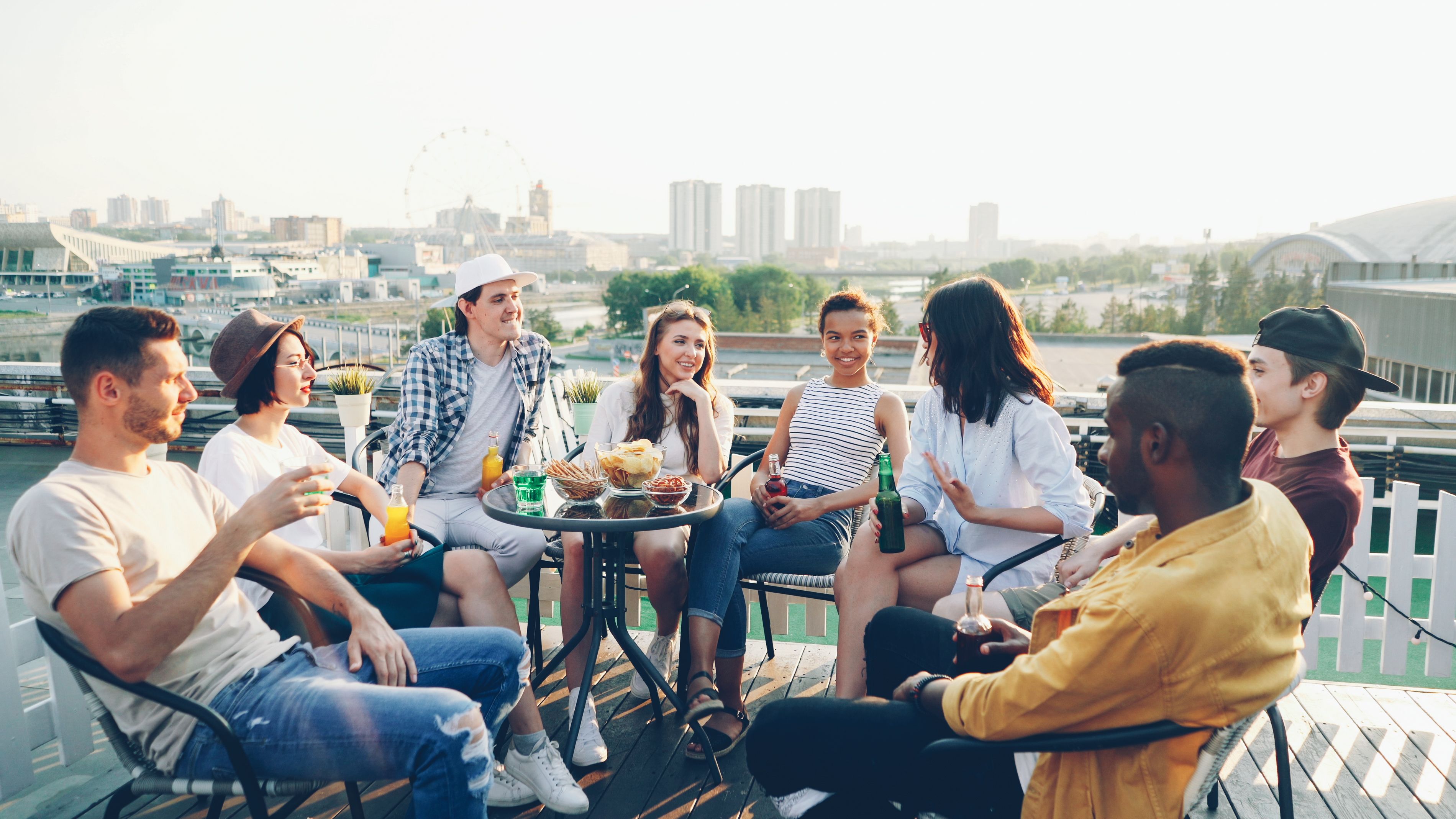 Rooftop Party with Friends Enjoying Drinks · Free Stock Photo