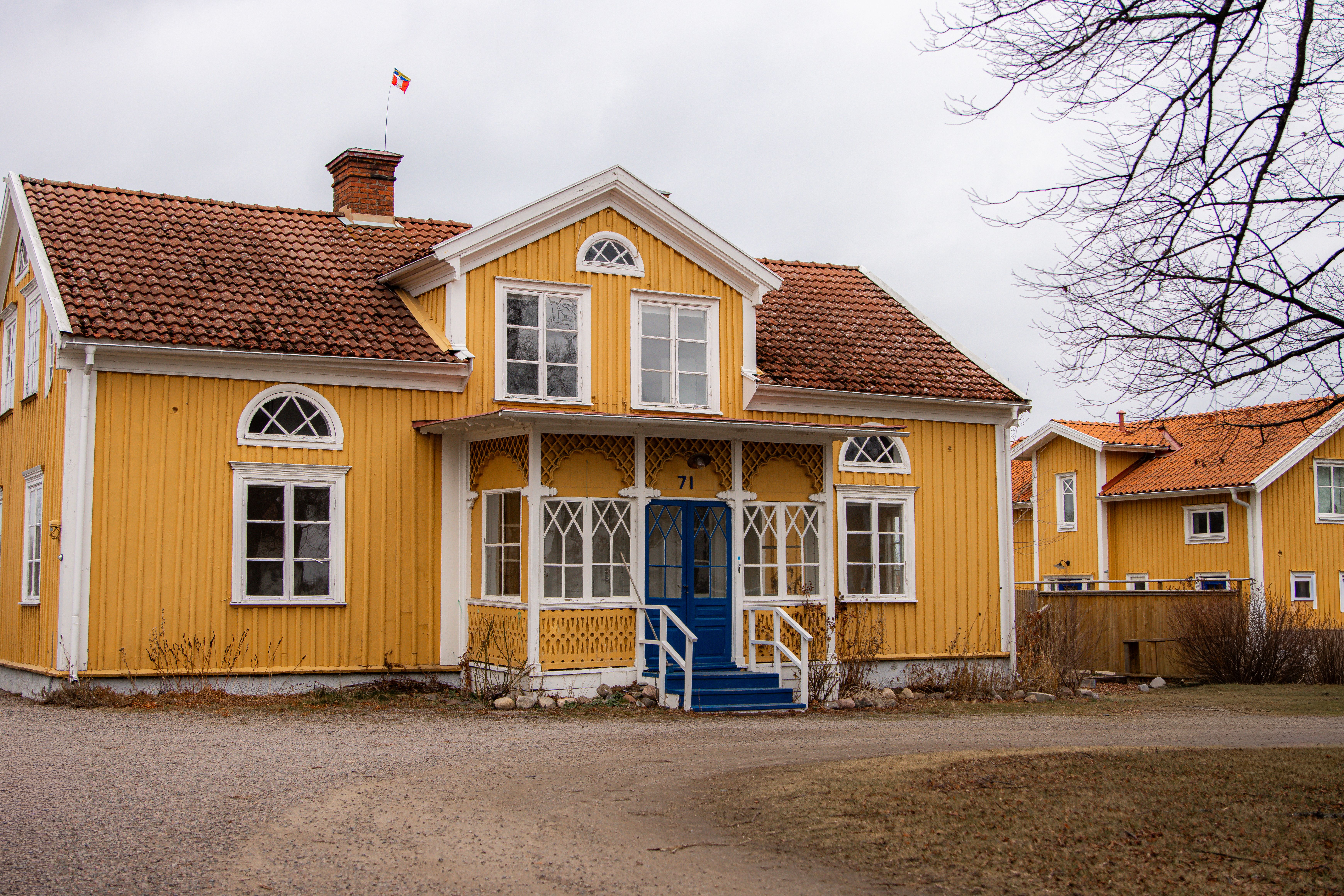 Charming Yellow Swedish Home with Blue Door · Free Stock Photo