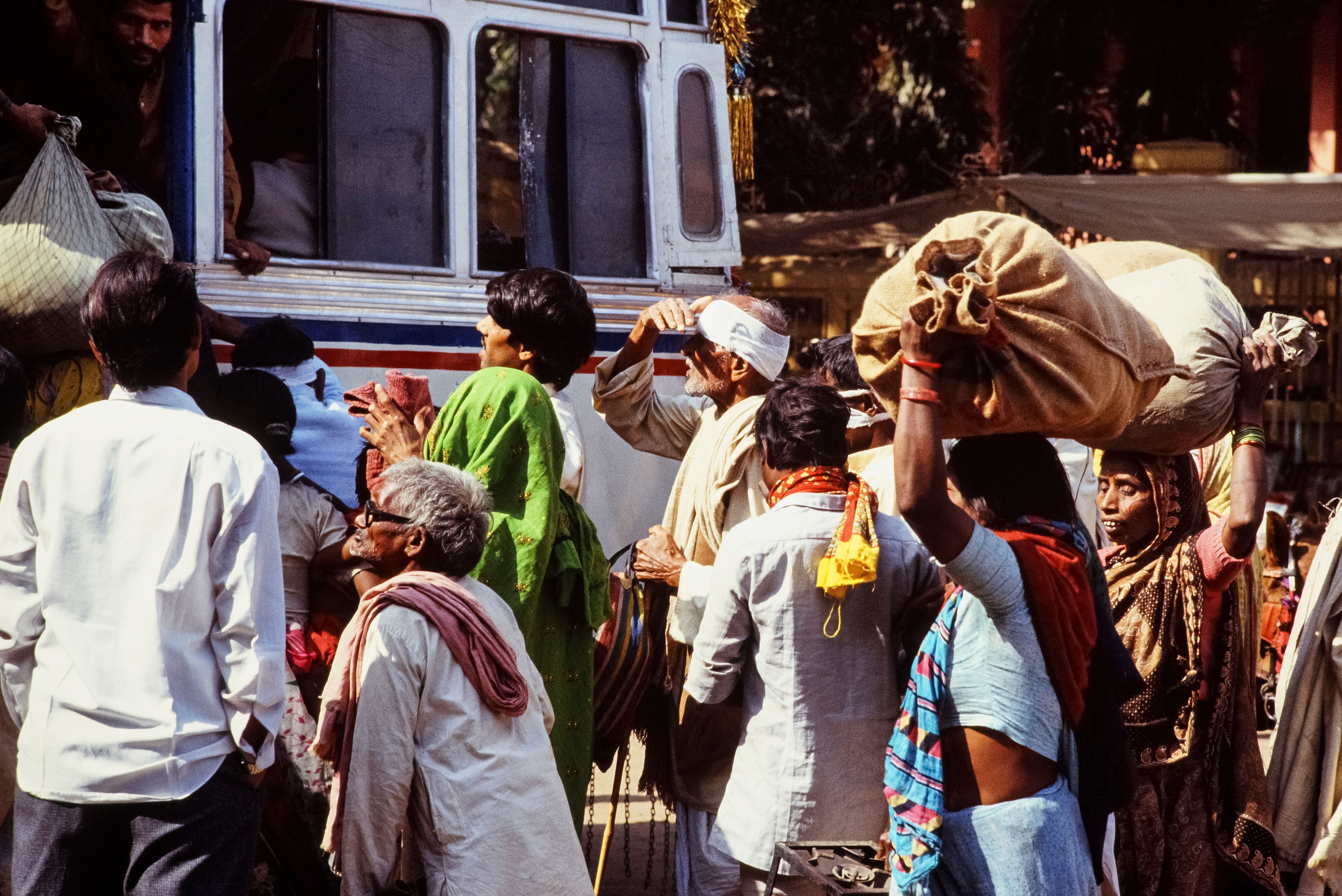 Busy Indian Bus Station Scene with Passengers · Free Stock Photo