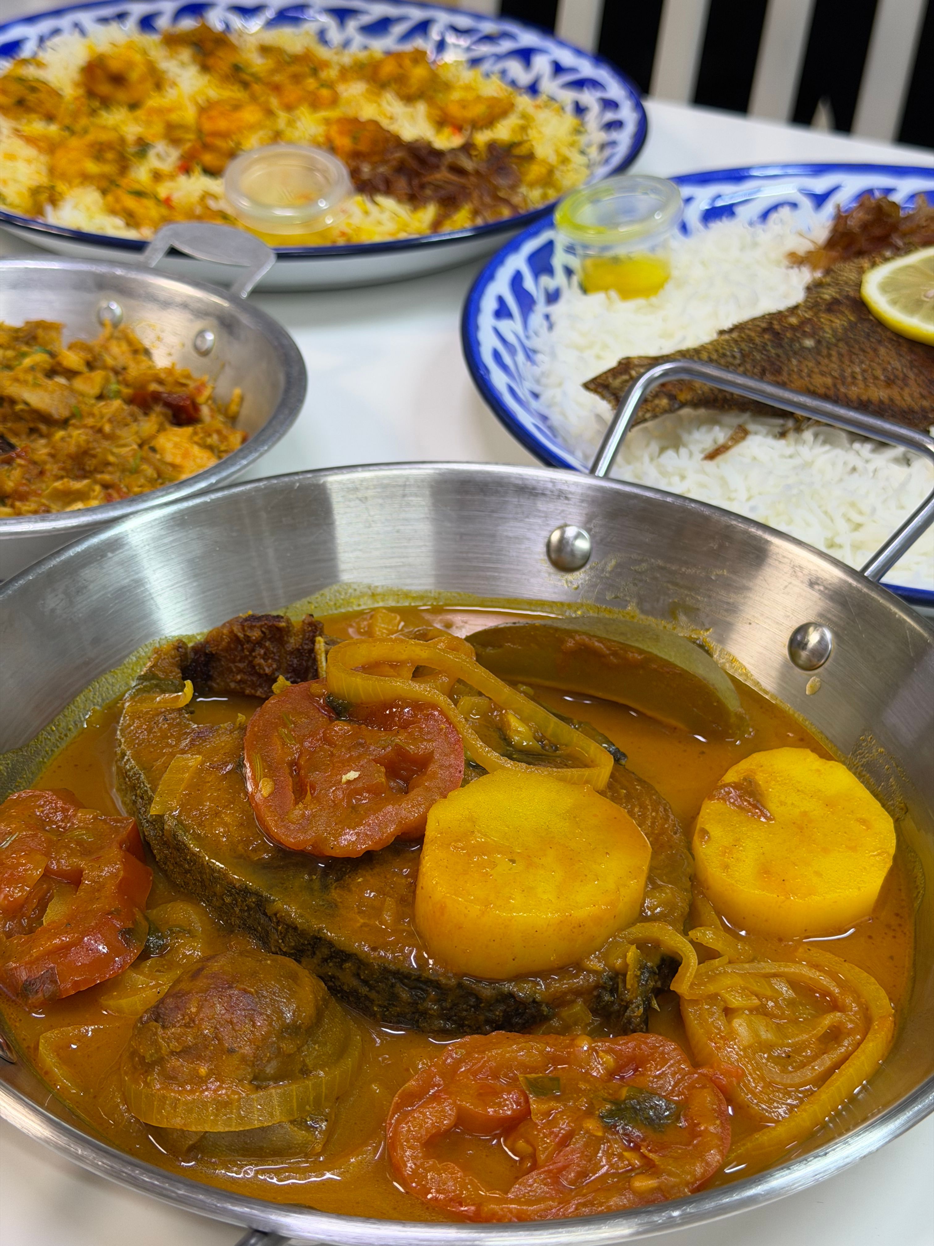 Authentic Gulf Dishes in Traditional Setting · Free Stock Photo