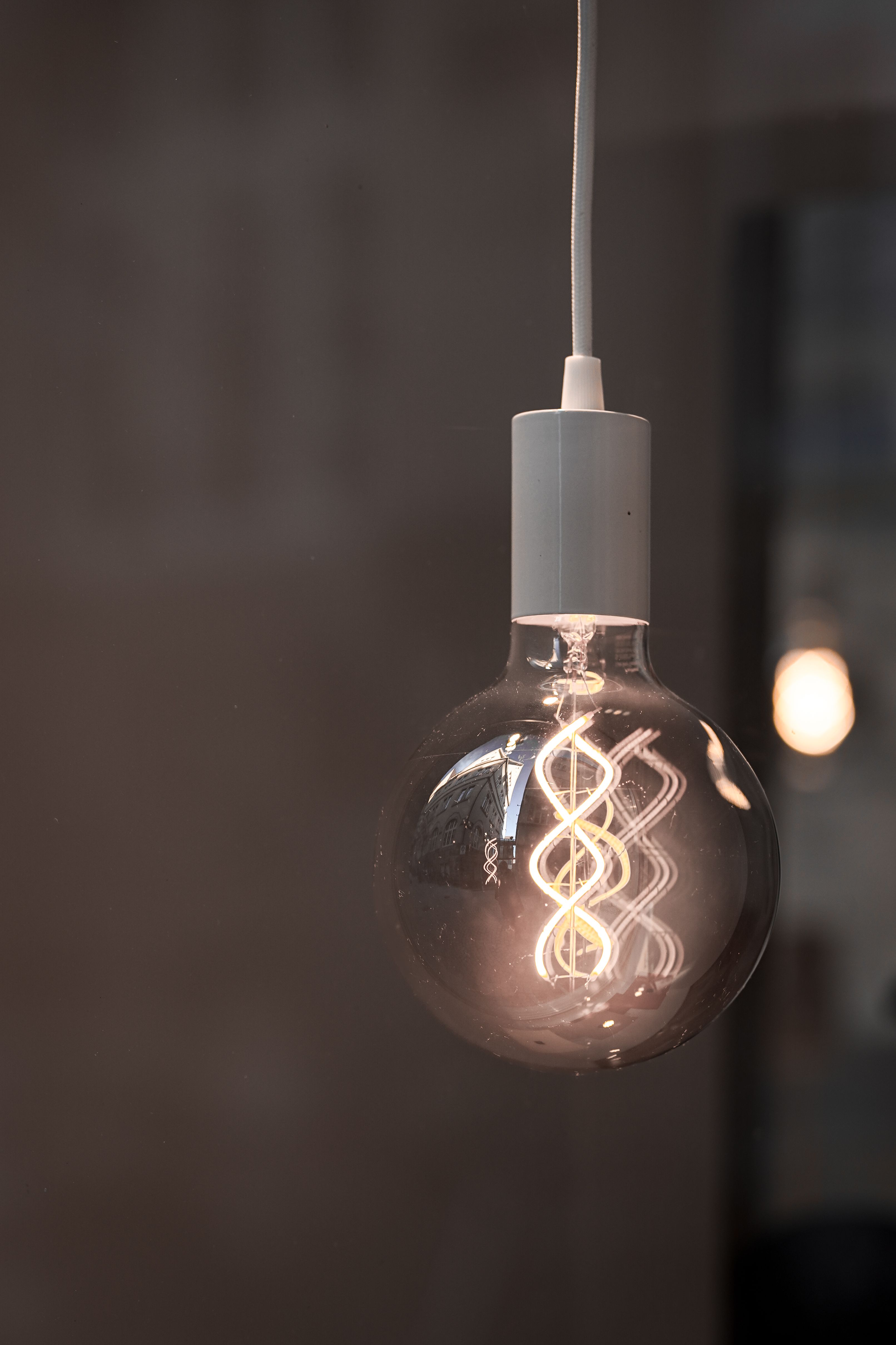 Vintage Edison Bulb with Spiral Filament · Free Stock Photo