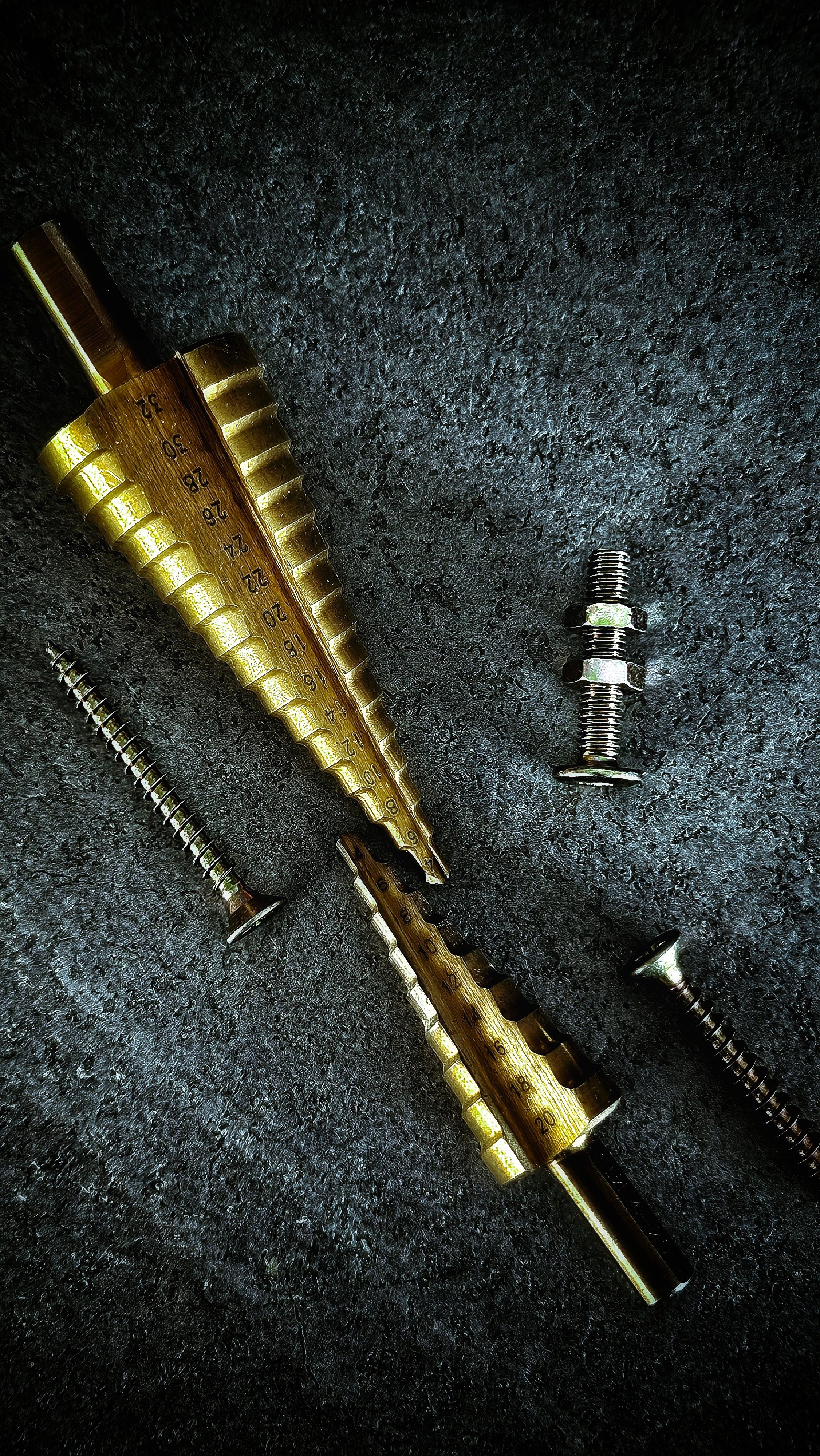 Industrial Drill Bits and Screws on Metal Surface · Free Stock Photo